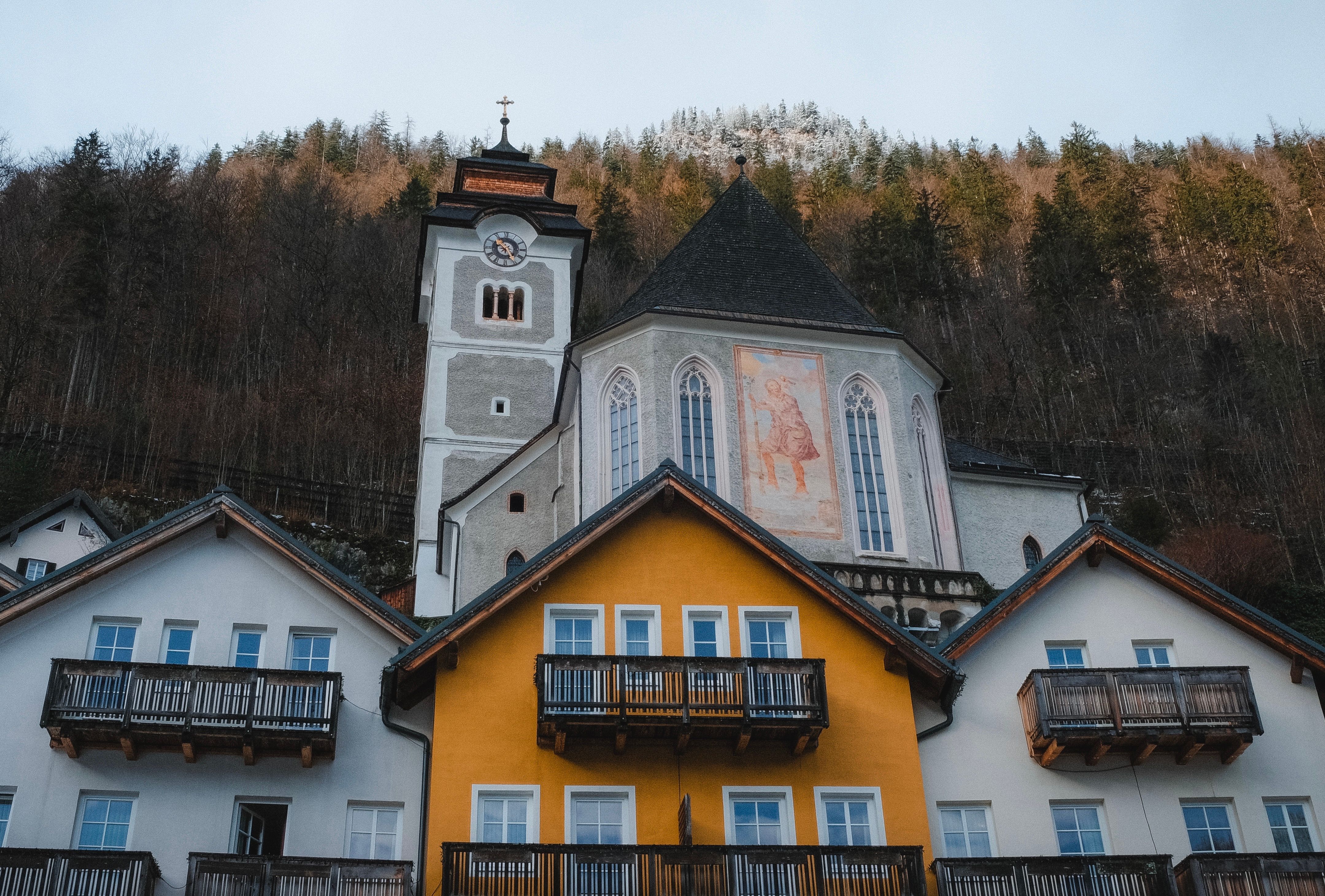Charming European Church and Colorful Houses · Free Stock Photo