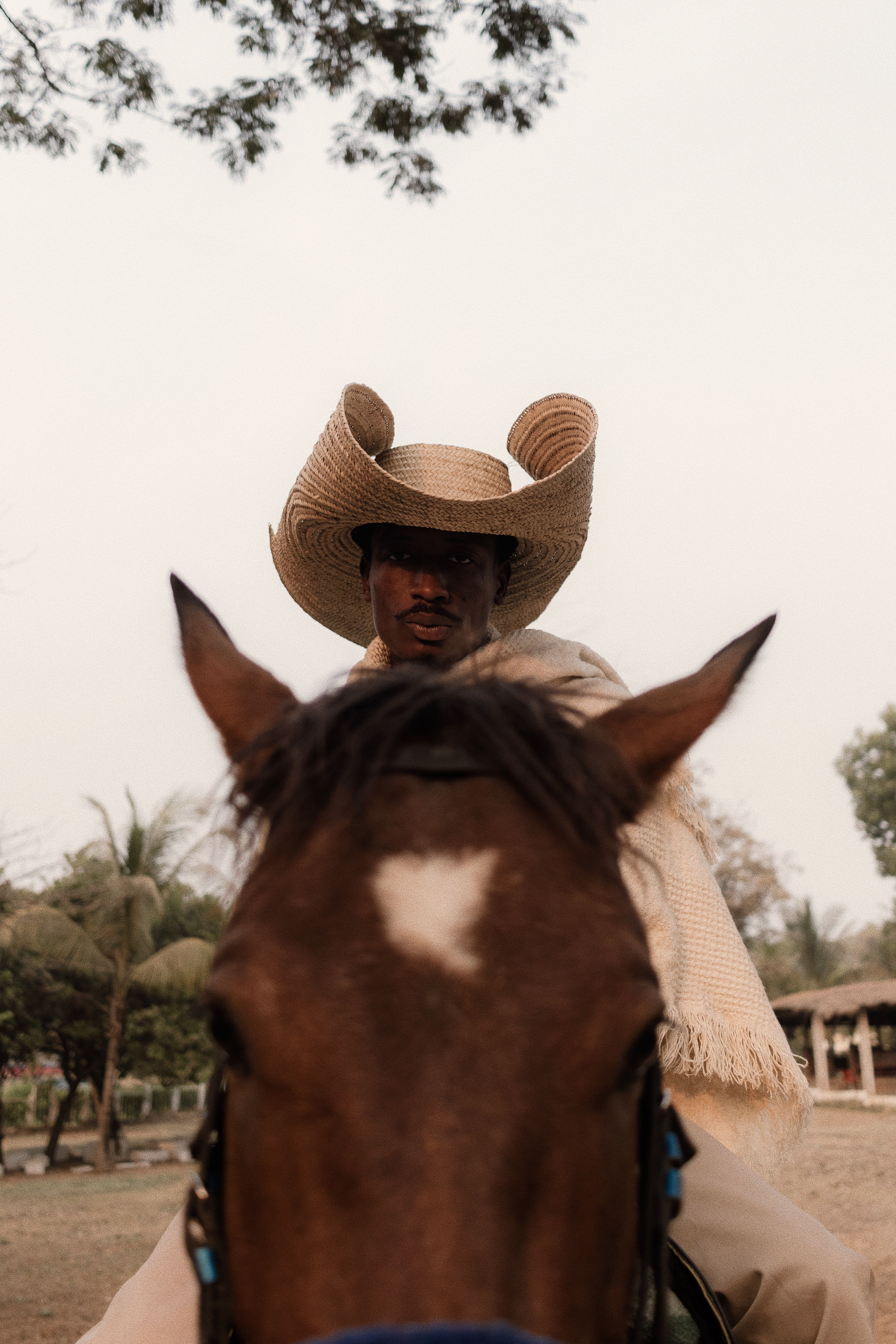 Nigerian Cowboy on Horseback in Natural Setting · Free Stock Photo