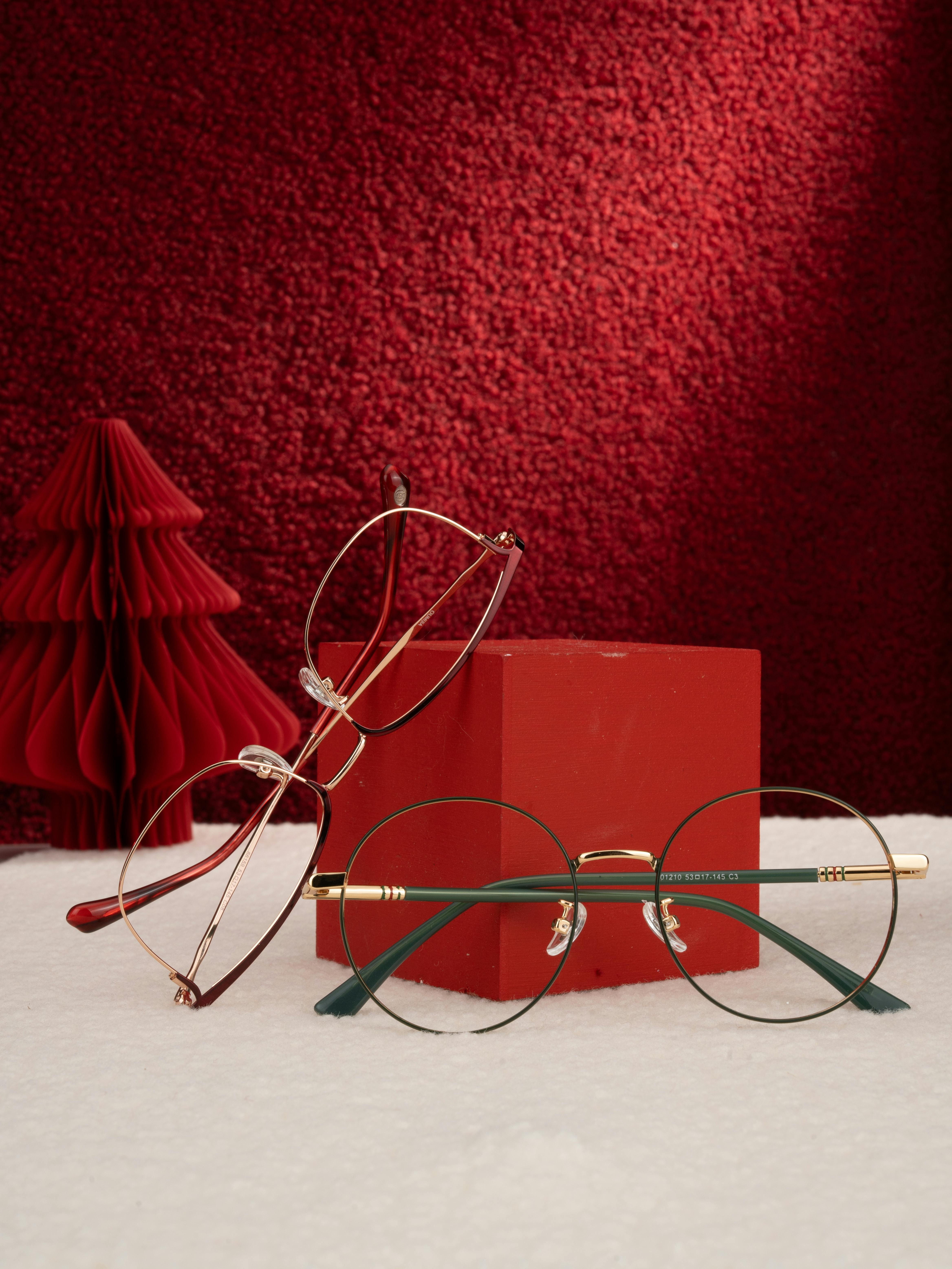 Elegant Eyewear Display with Festive Backdrop · Free Stock Photo