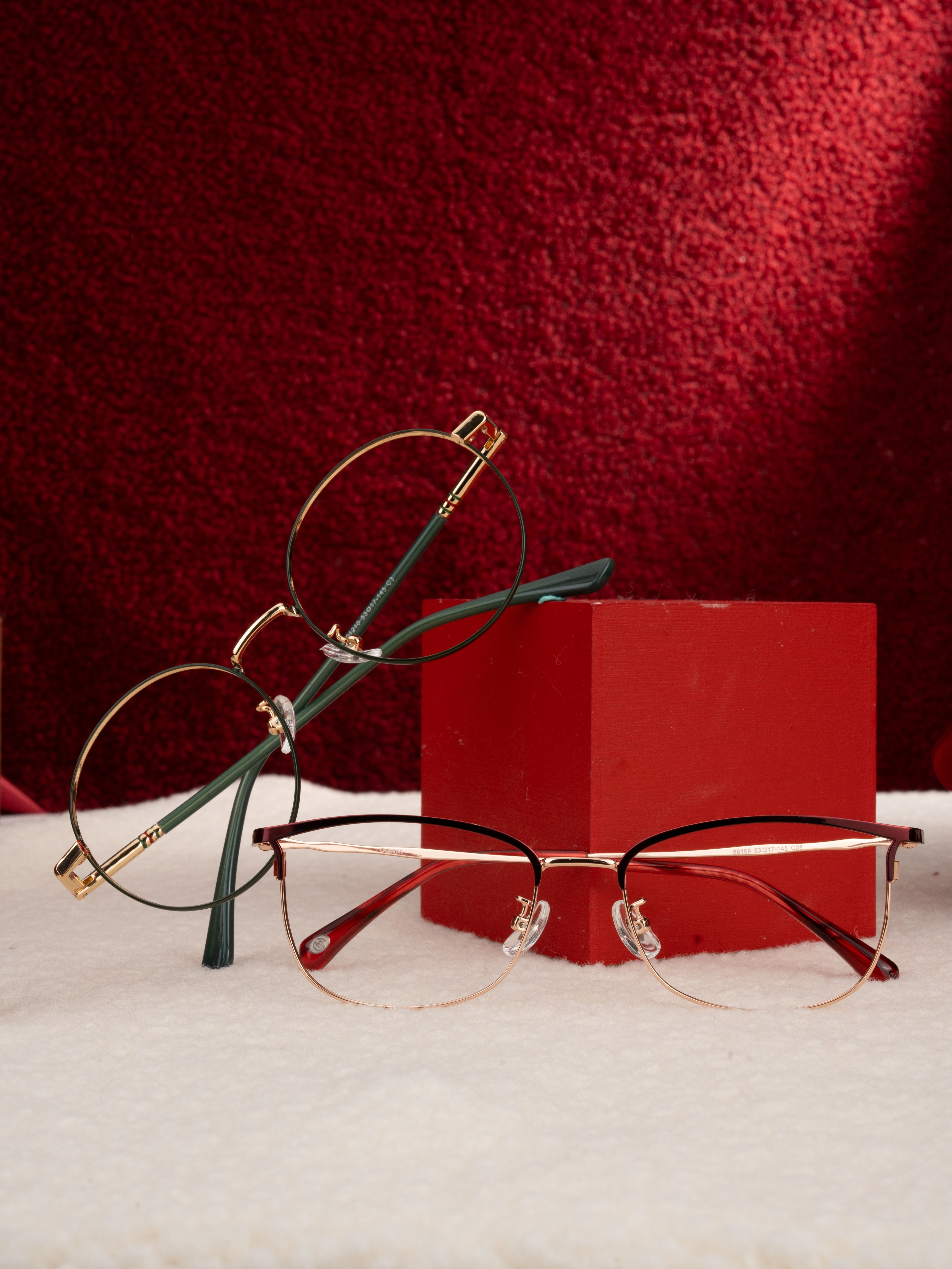 Elegant Eyewear Display on Red and White Background · Free Stock Photo