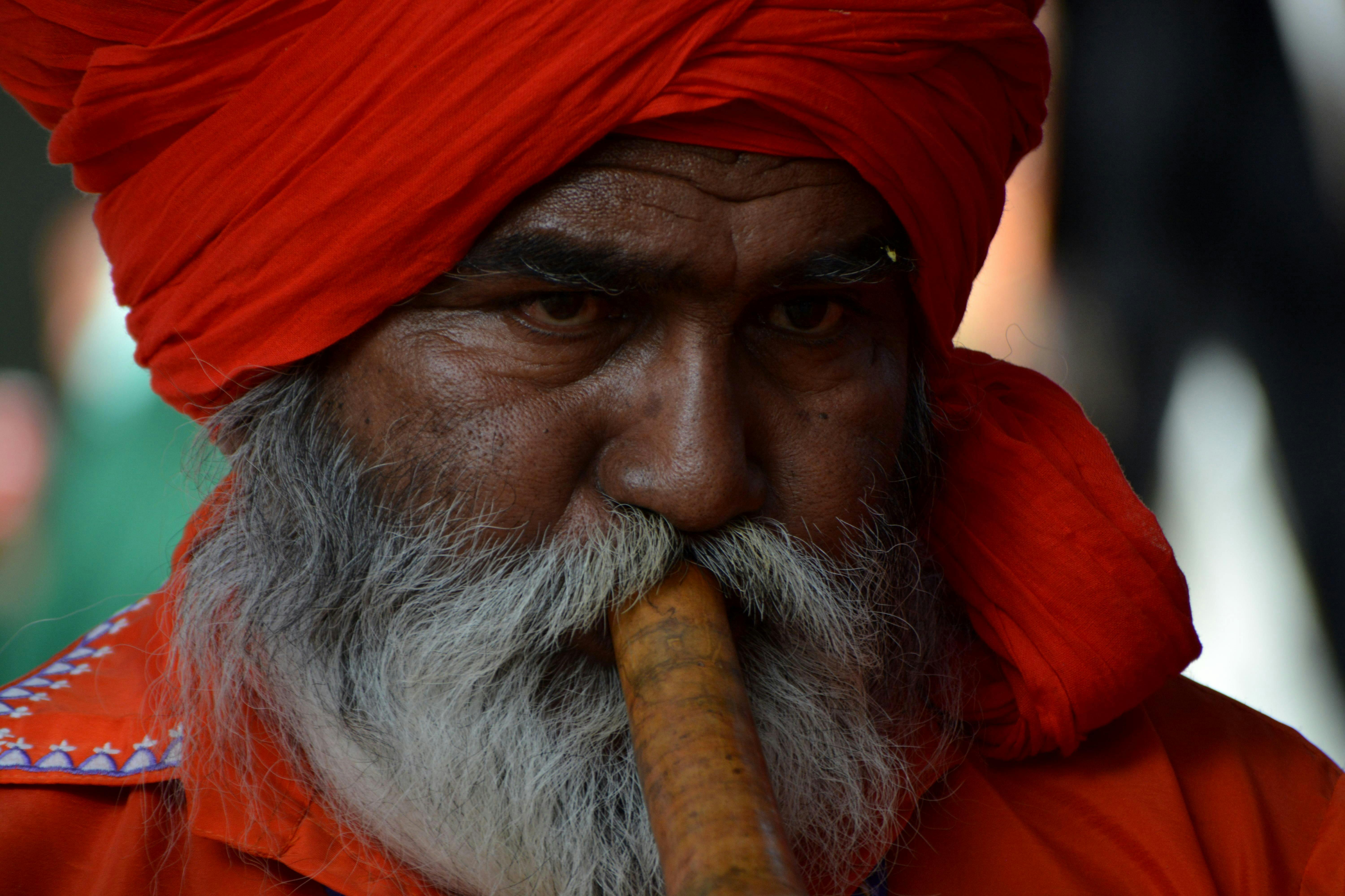 Elderly Indian Man Playing Traditional Instrument · Free Stock Photo