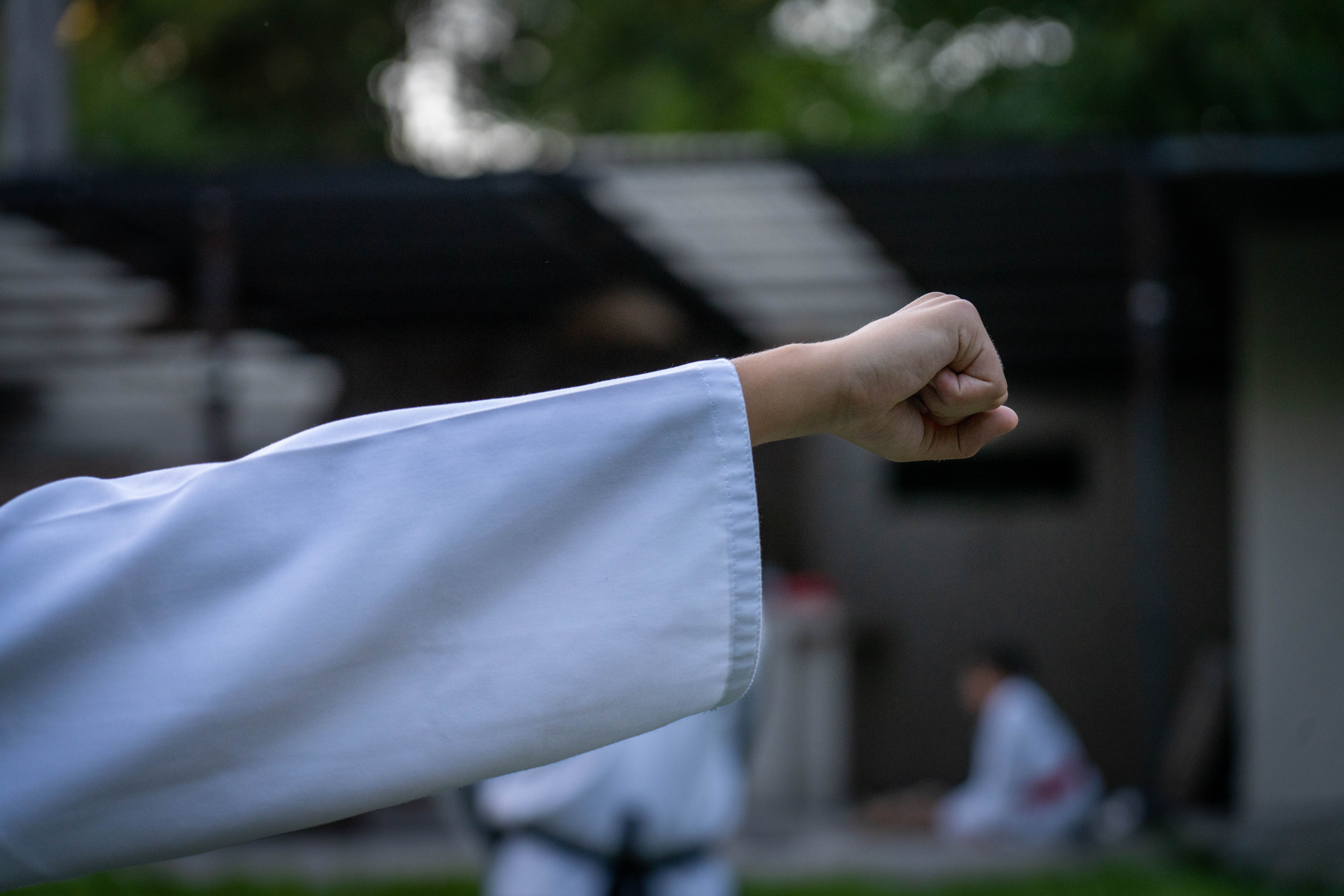 Karate Practice with Fist Pose Outdoors · Free Stock Photo