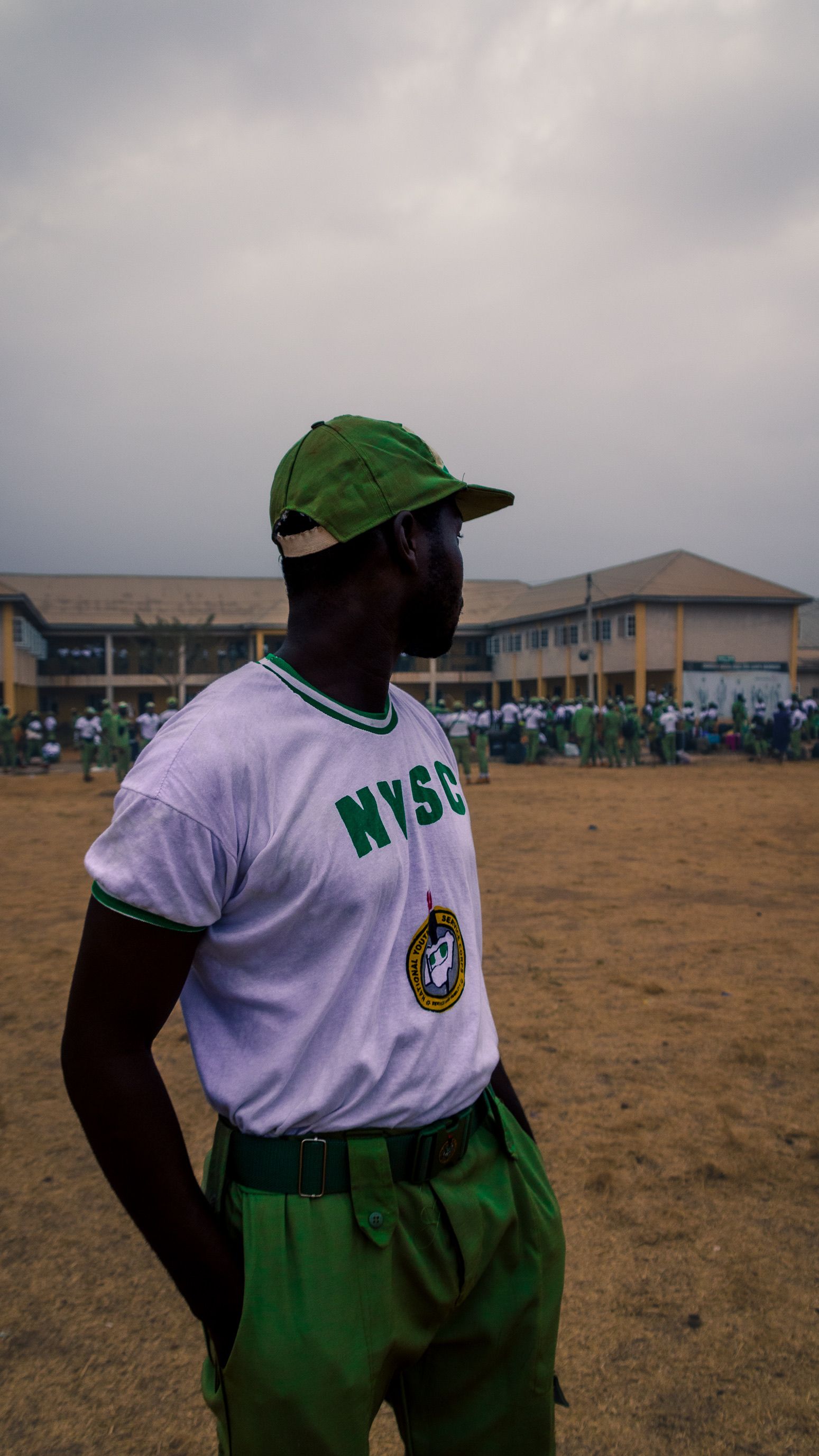 NYSC Member Wearing Uniform Outdoors · Free Stock Photo