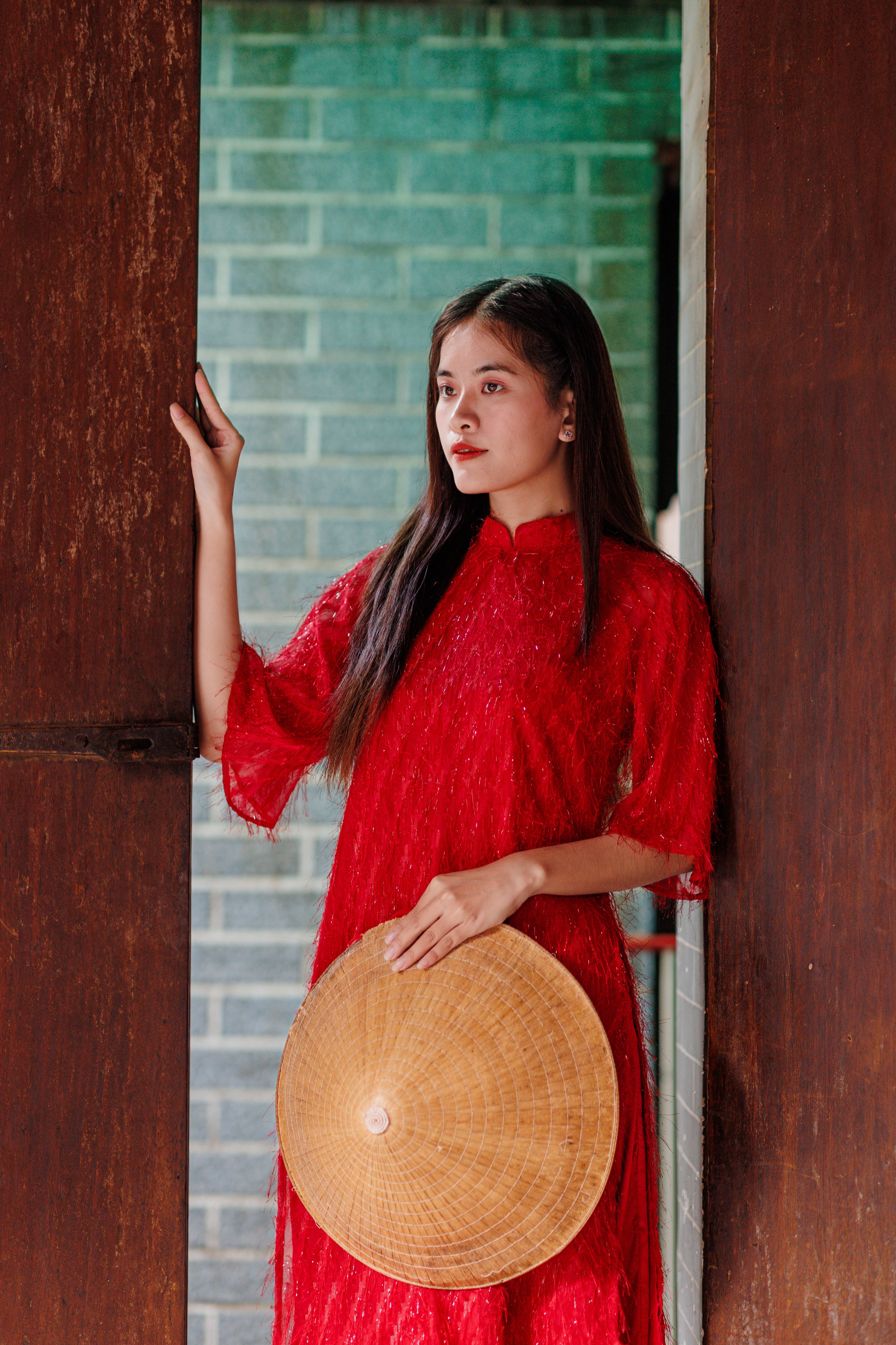 Young Woman in Traditional Red Vietnamese Dress · Free Stock Photo