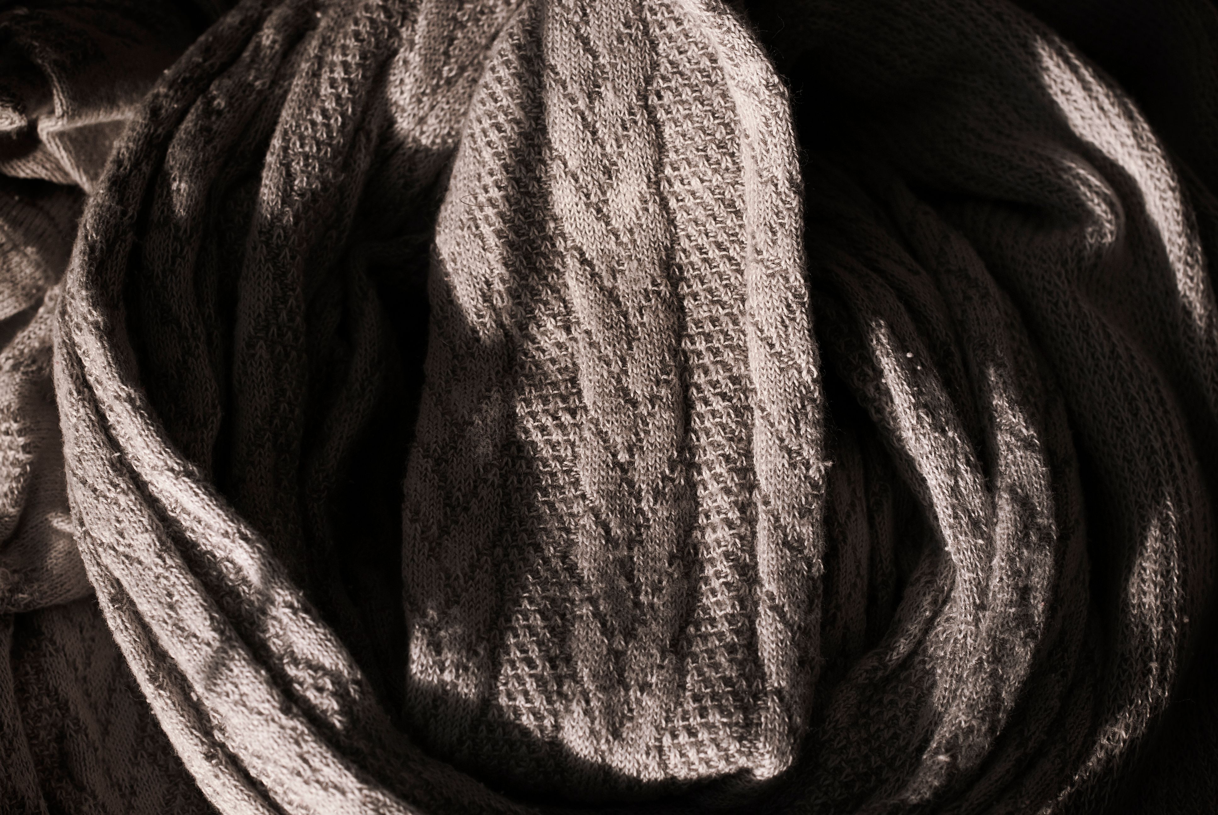 Close-up of Textured Knitted Fabric in Warm Light · Free Stock Photo