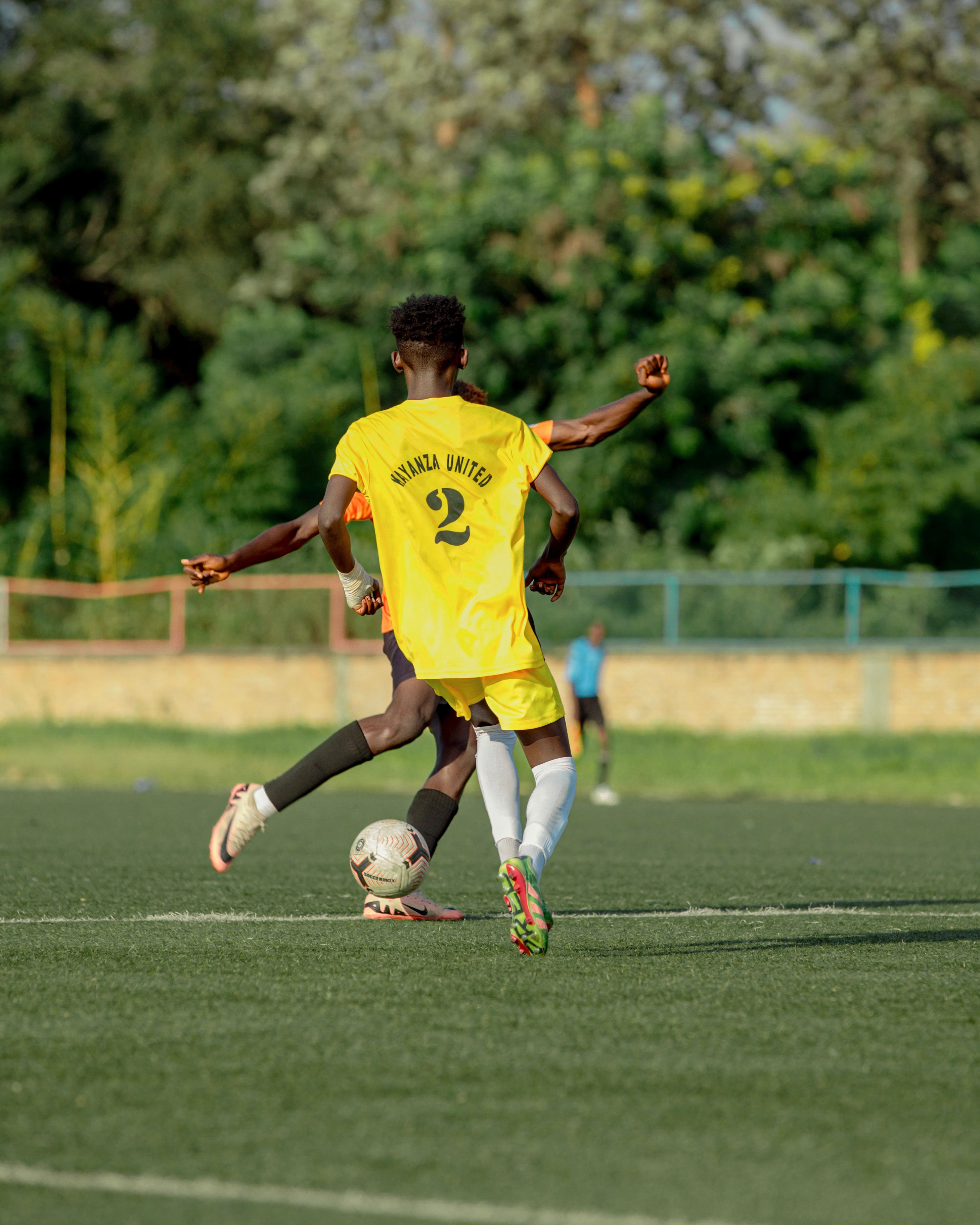Outdoor Soccer Match with Players in Action · Free Stock Photo