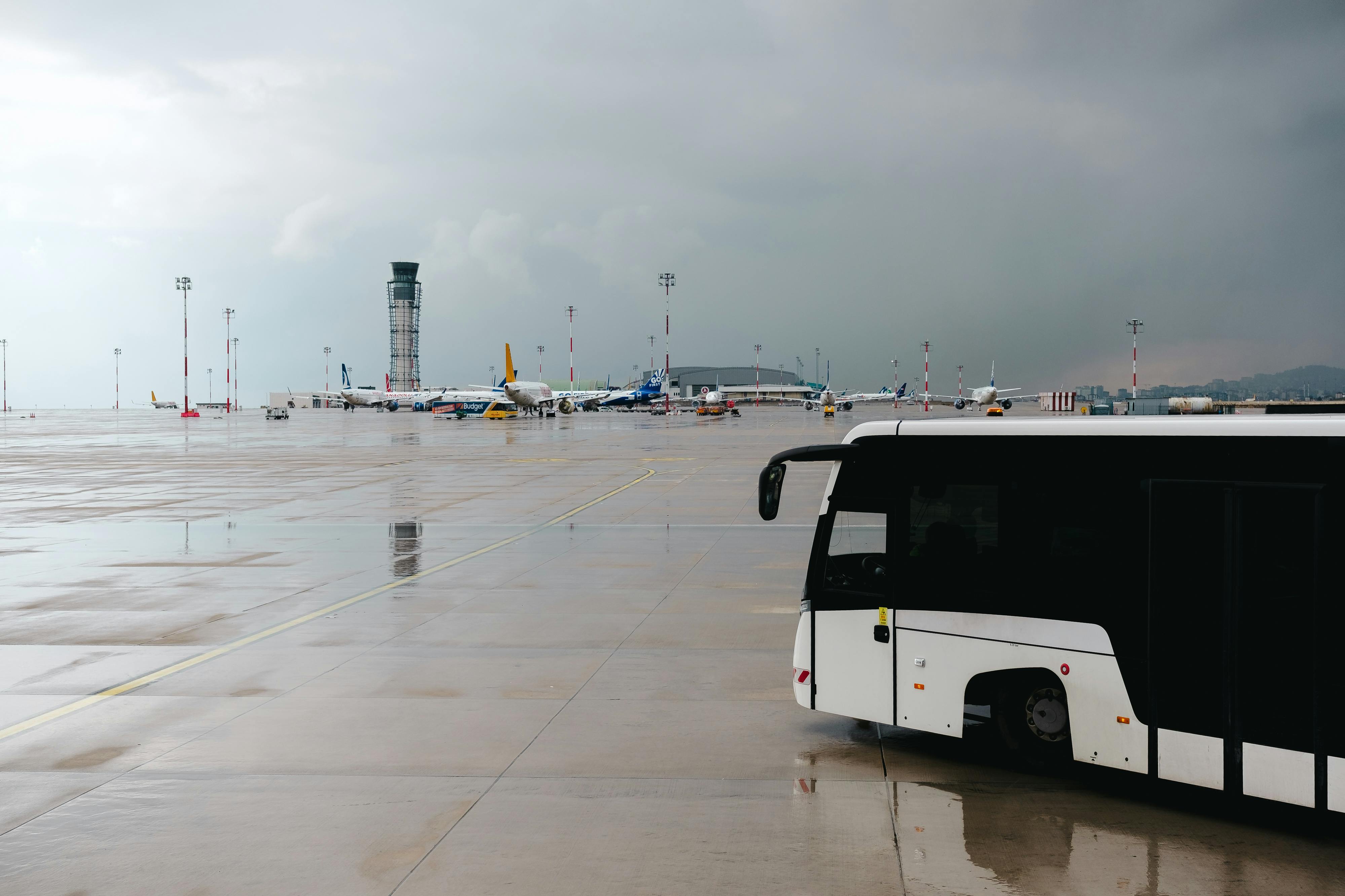 Airport Tarmac with Passenger Bus and Airplanes · Free Stock Photo