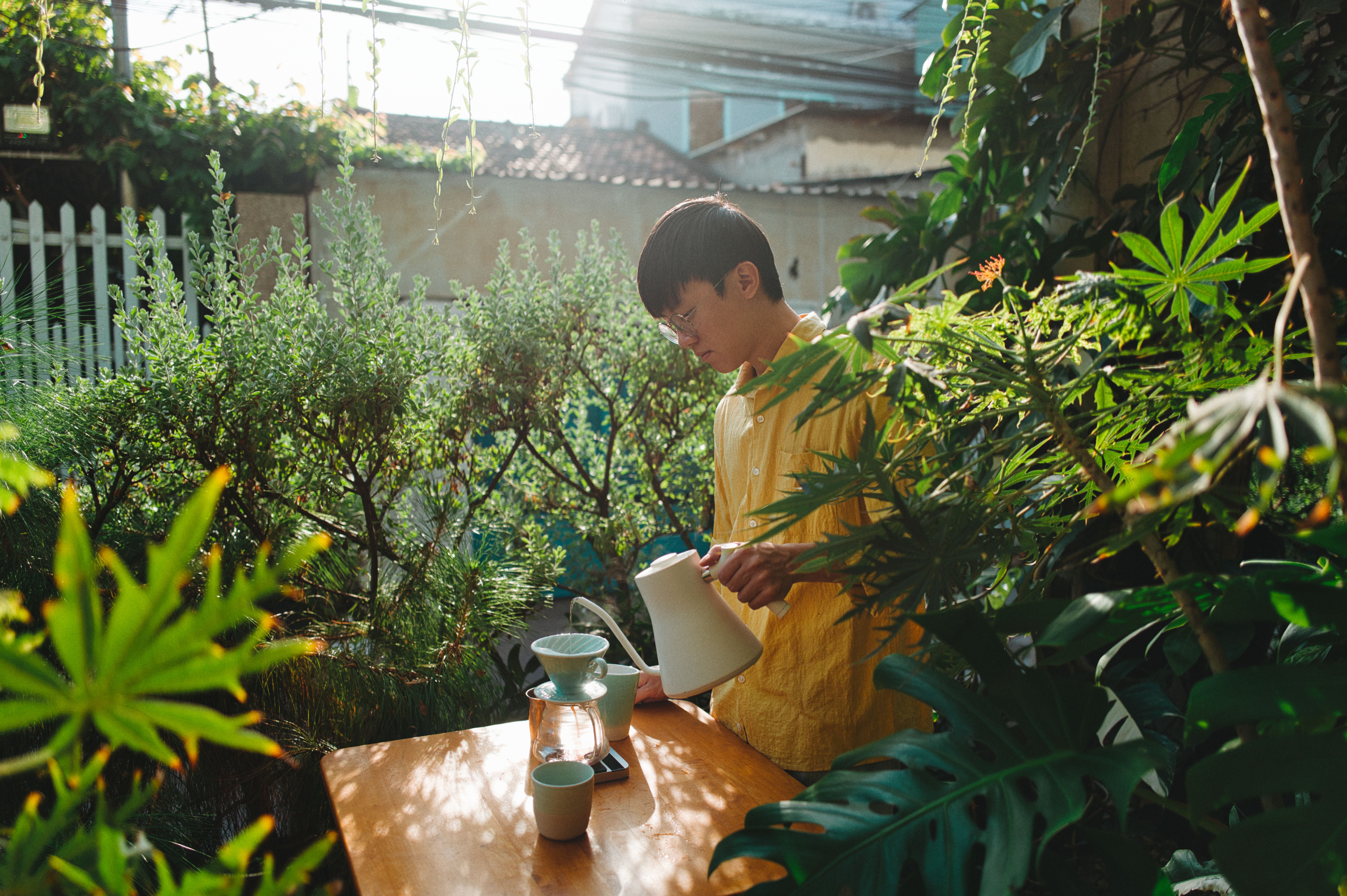 Man Brewing Coffee in Lush Green Garden · Free Stock Photo