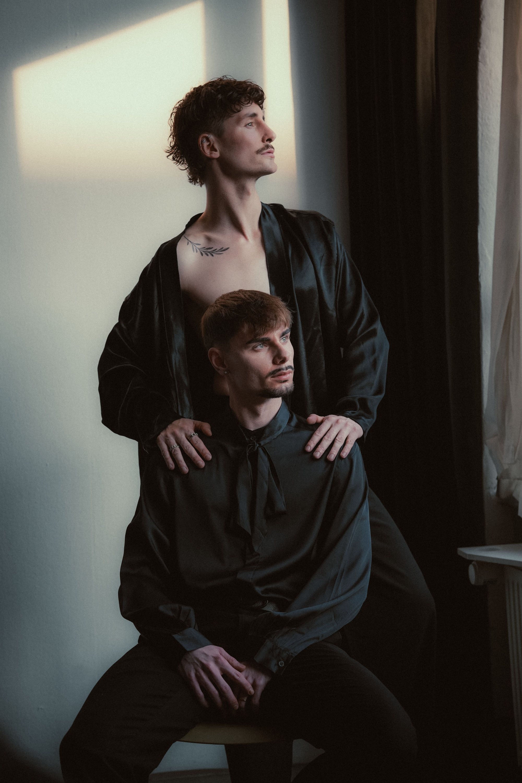 Dramatic Portrait of Two Men in Stylish Attire · Free Stock Photo