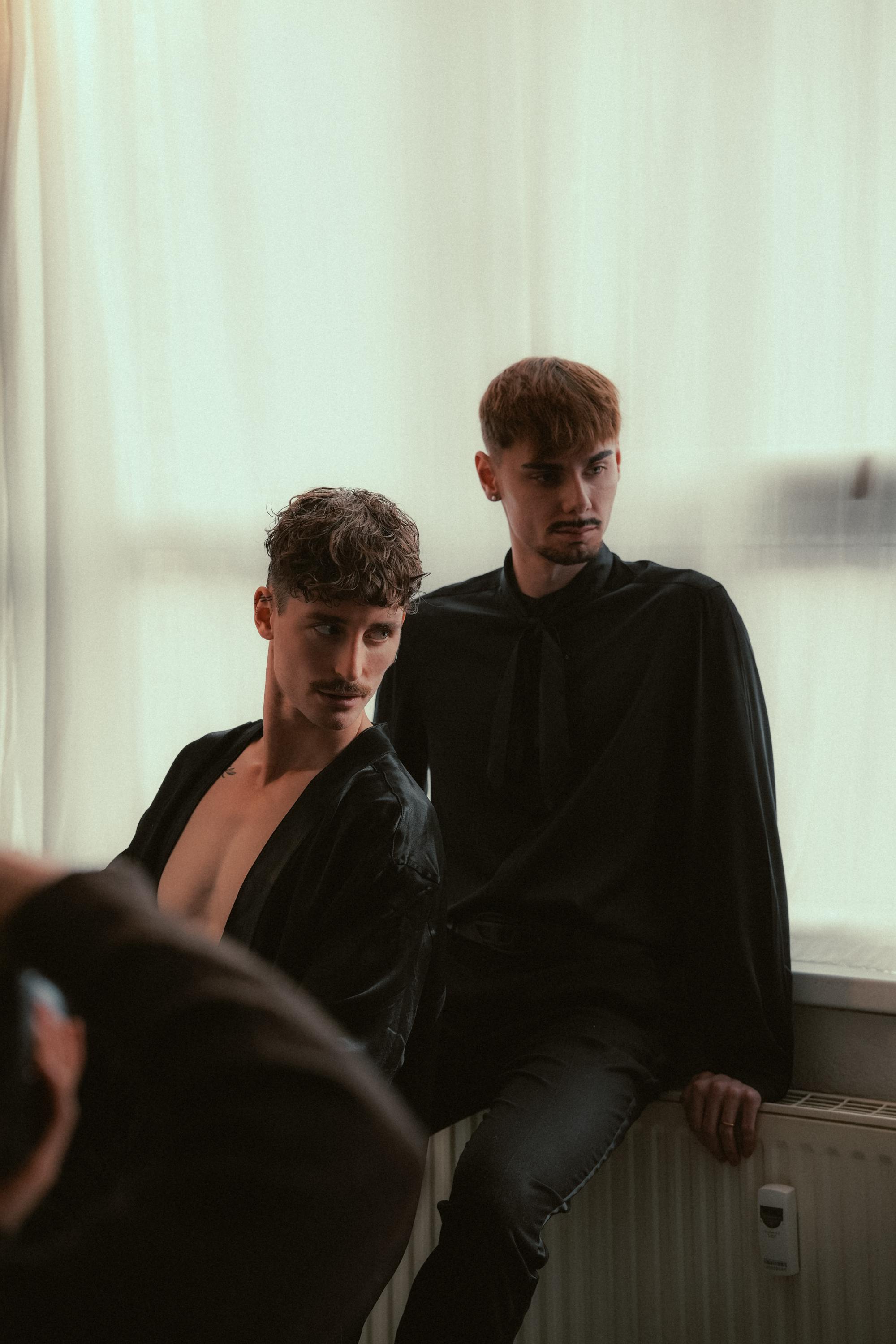 Two Men in Dramatic Indoor Lighting Portrait · Free Stock Photo