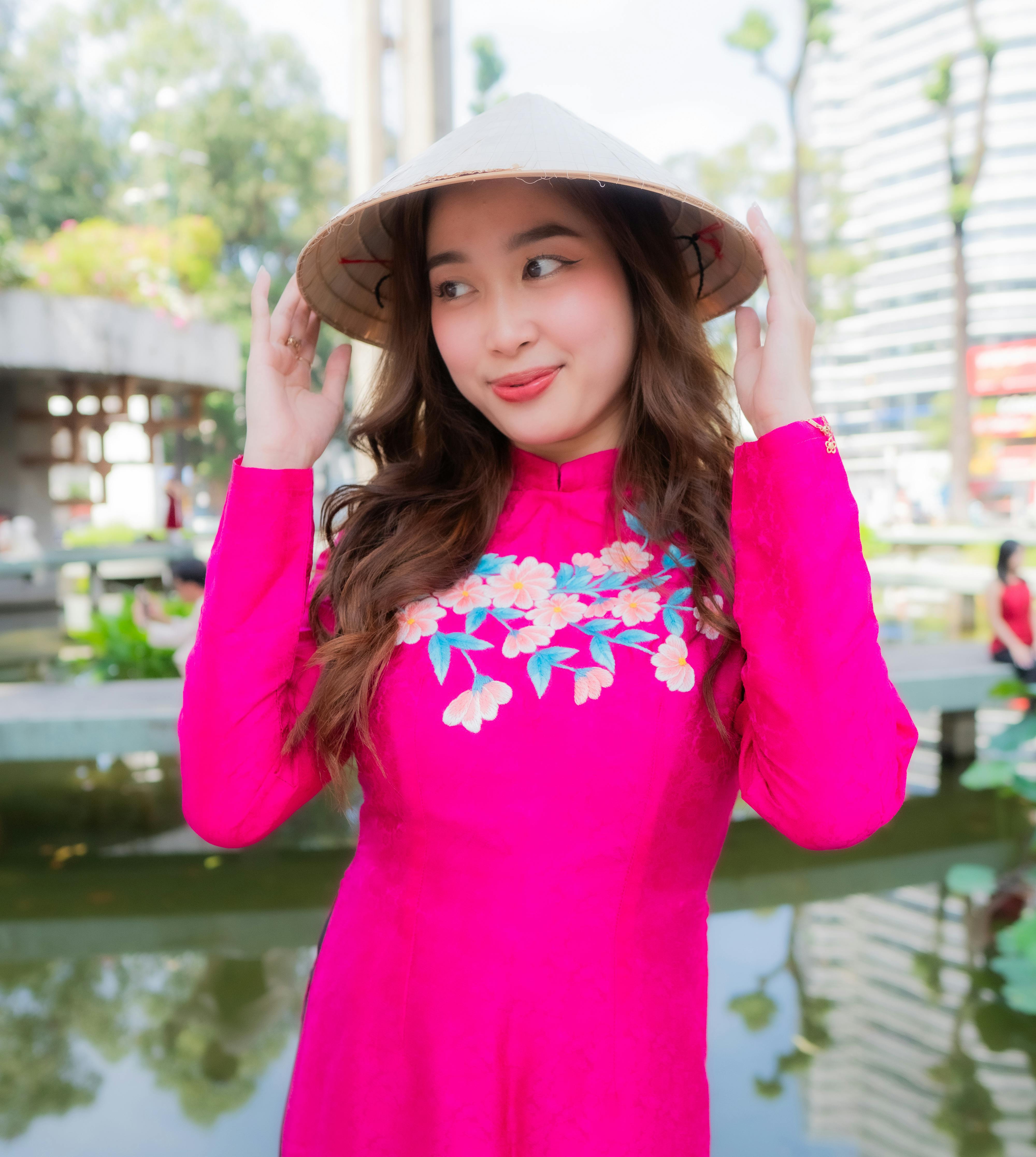 Young Woman in Pink Ao Dai with Conical Hat · Free Stock Photo