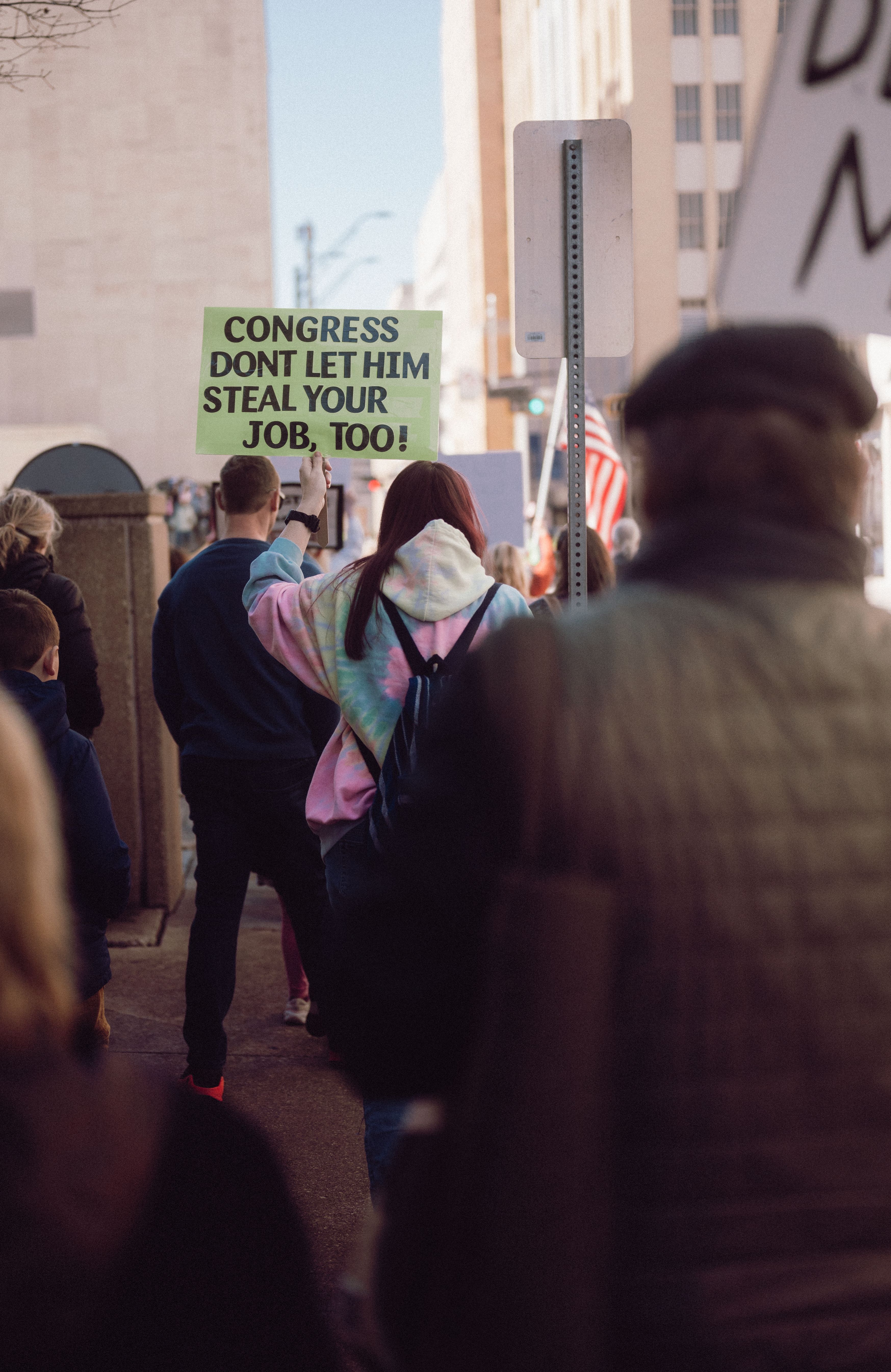 Protesters Holding Signs at Urban Demonstration · Free Stock Photo