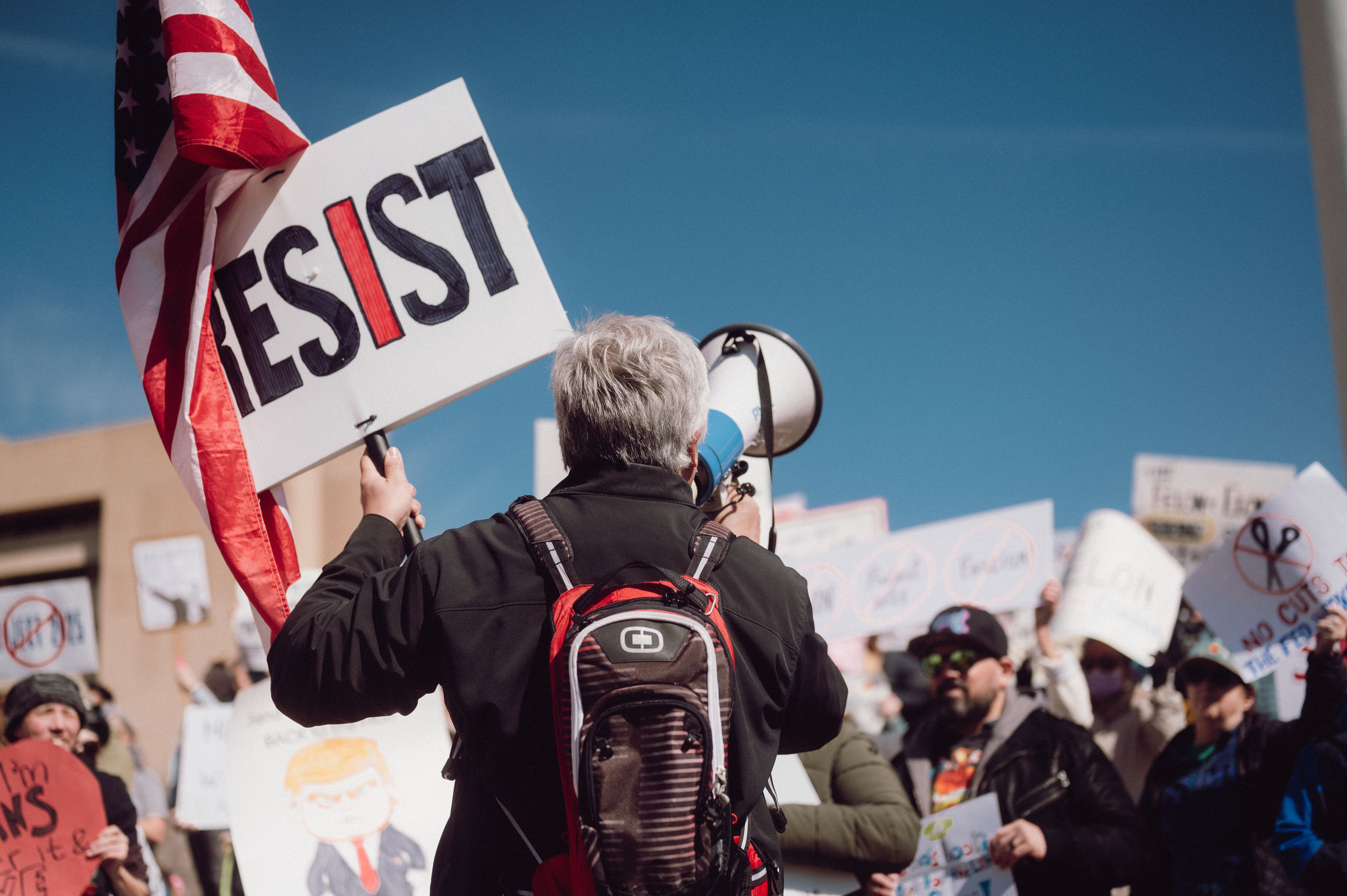 Protesters holding signs at a rally · Free Stock Photo