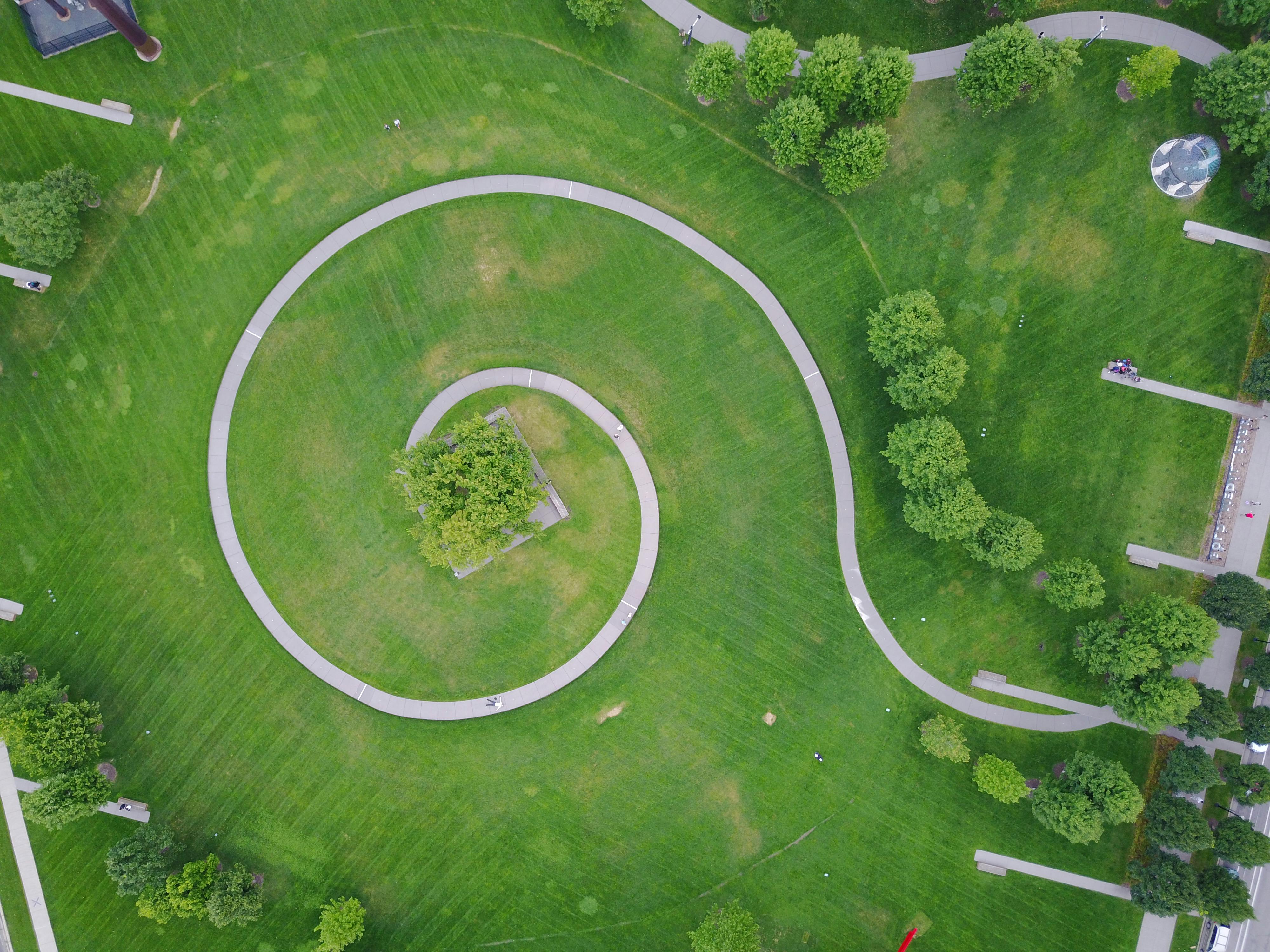 Aerial View of Spiral Pathway in Green Park · Free Stock Photo