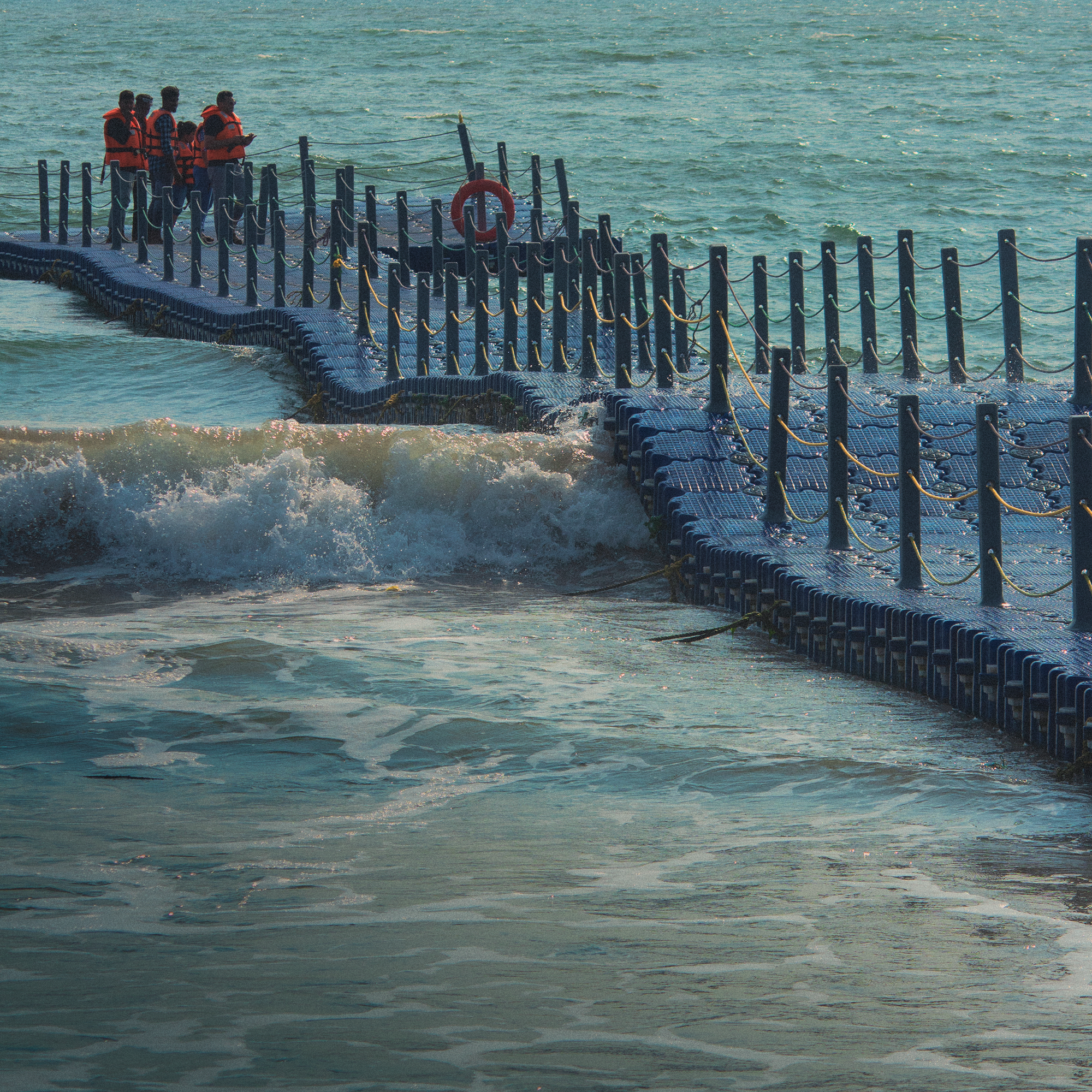 Floating Pier with People on Calm Ocean Waters · Free Stock Photo