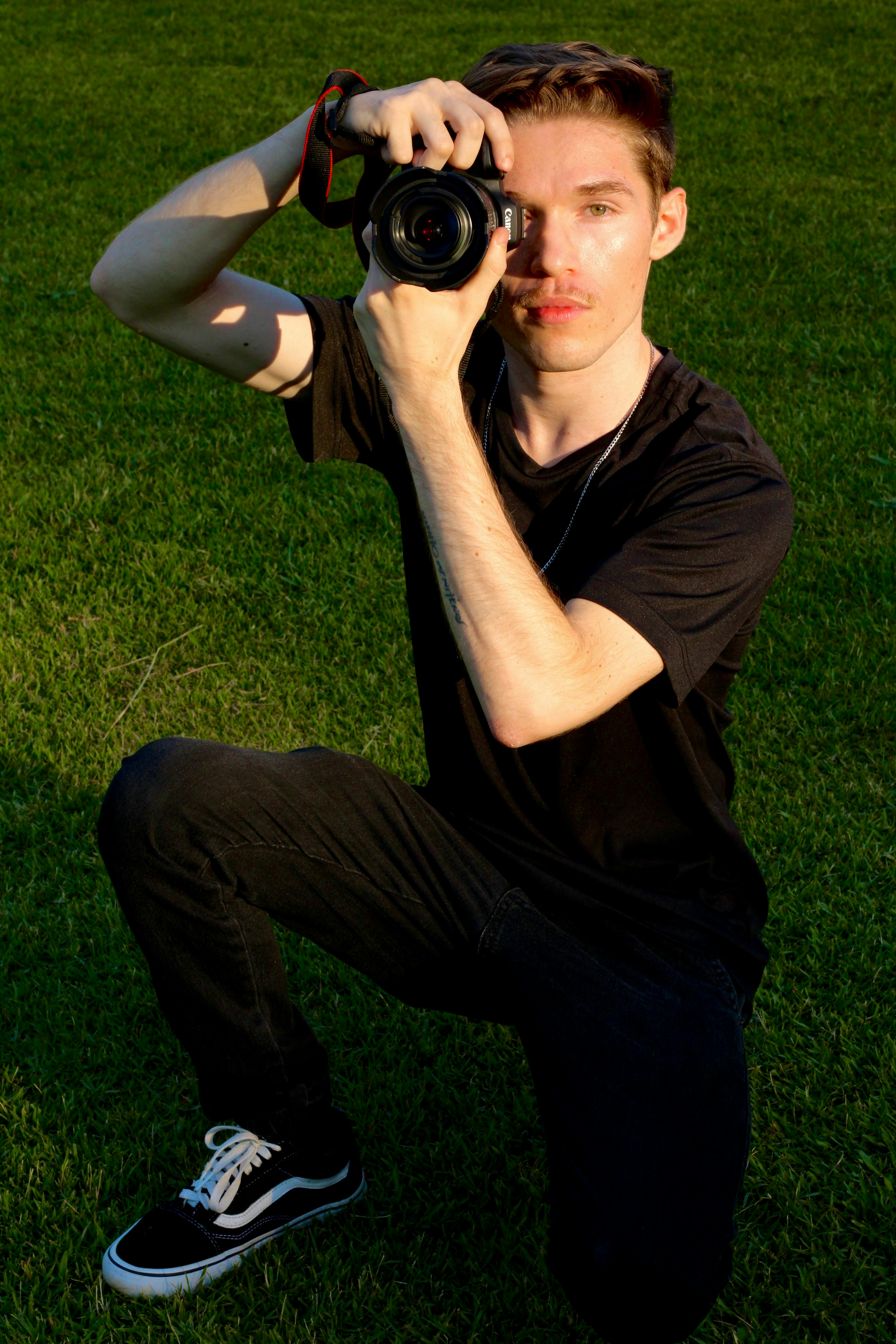 Male Photographer Taking Picture Outdoors · Free Stock Photo