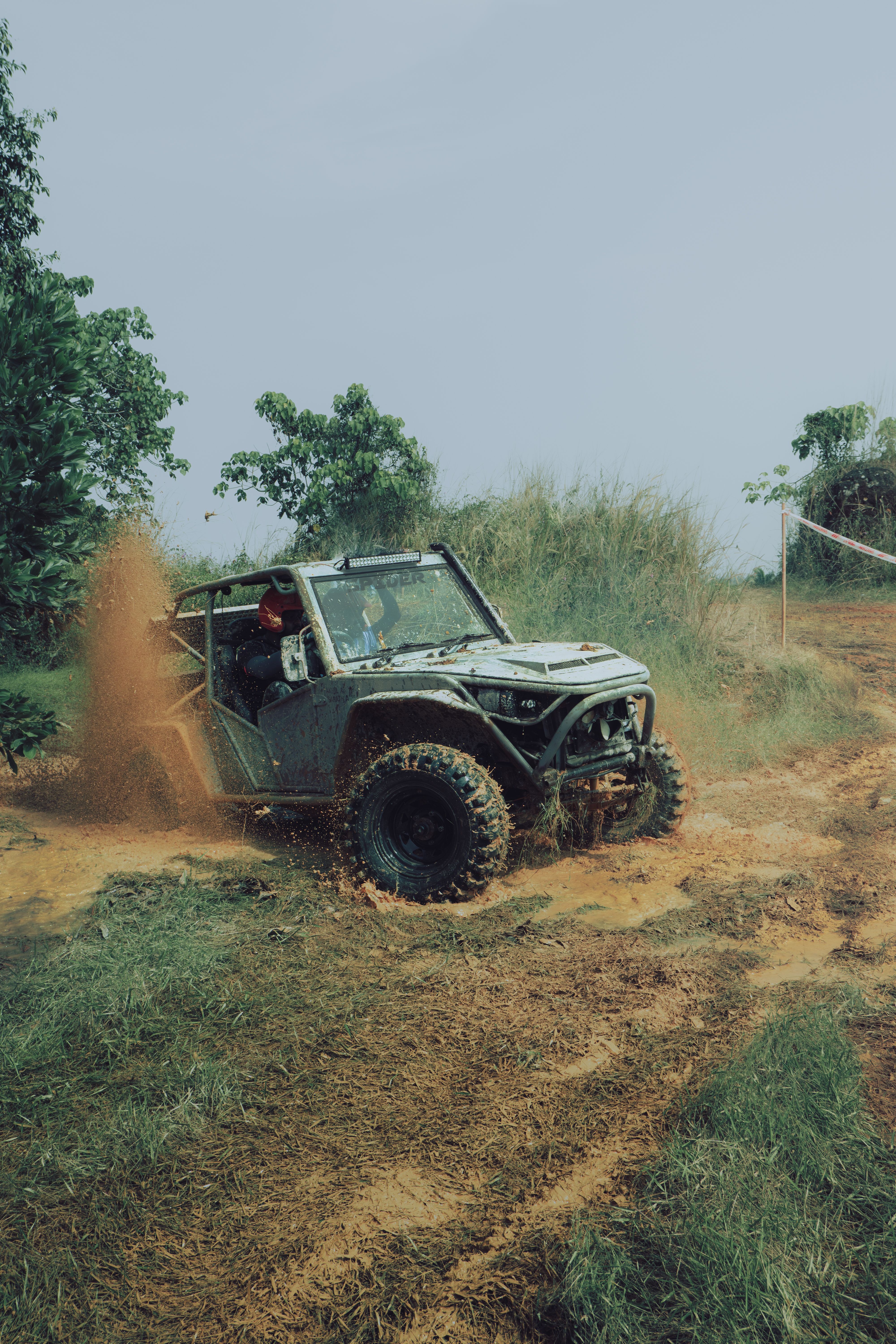 Off-Road Adventure with Muddy All-Terrain Vehicle · Free Stock Photo
