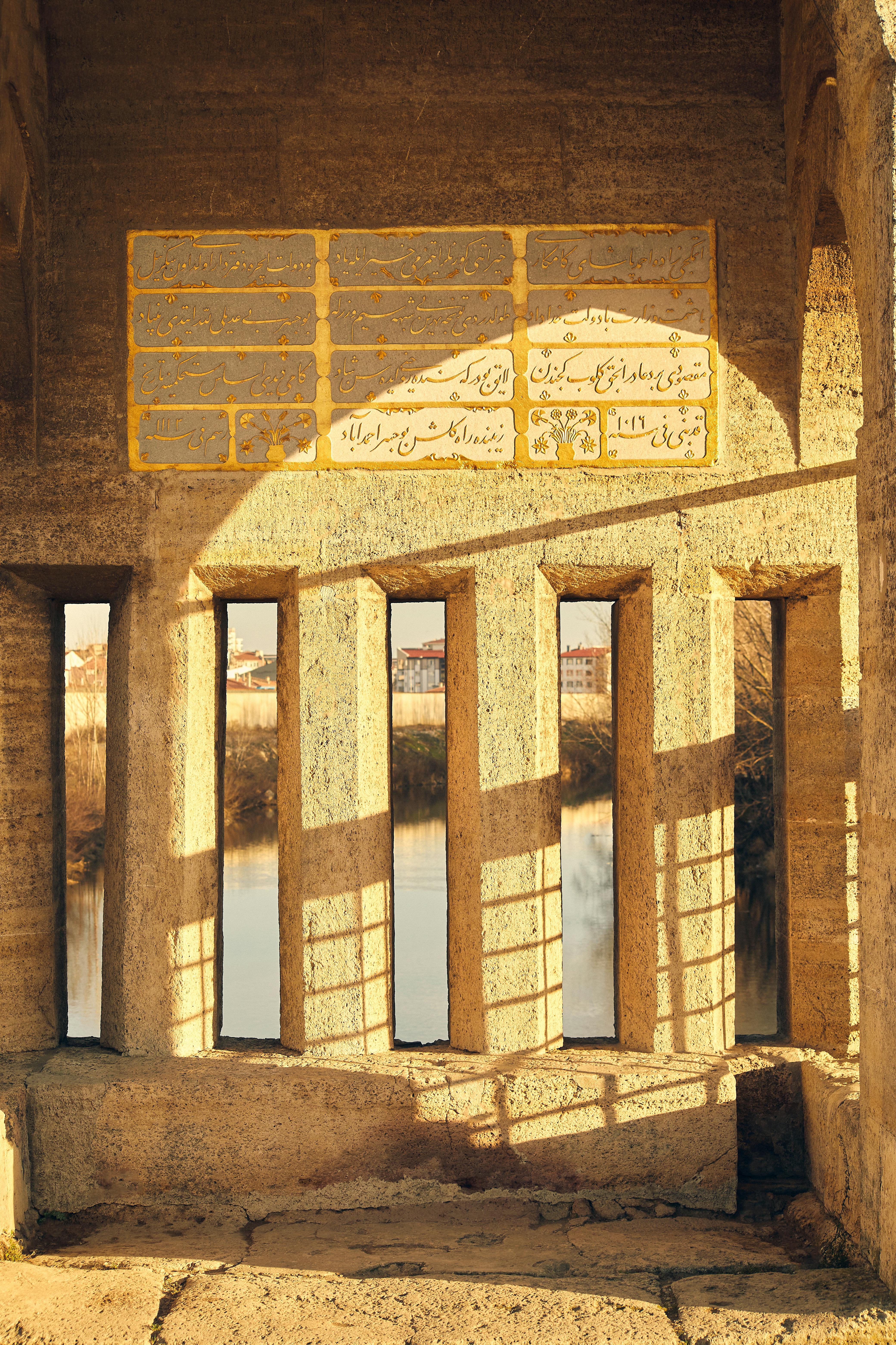 Sunset Light Casting Shadows in Ancient Structure · Free Stock Photo