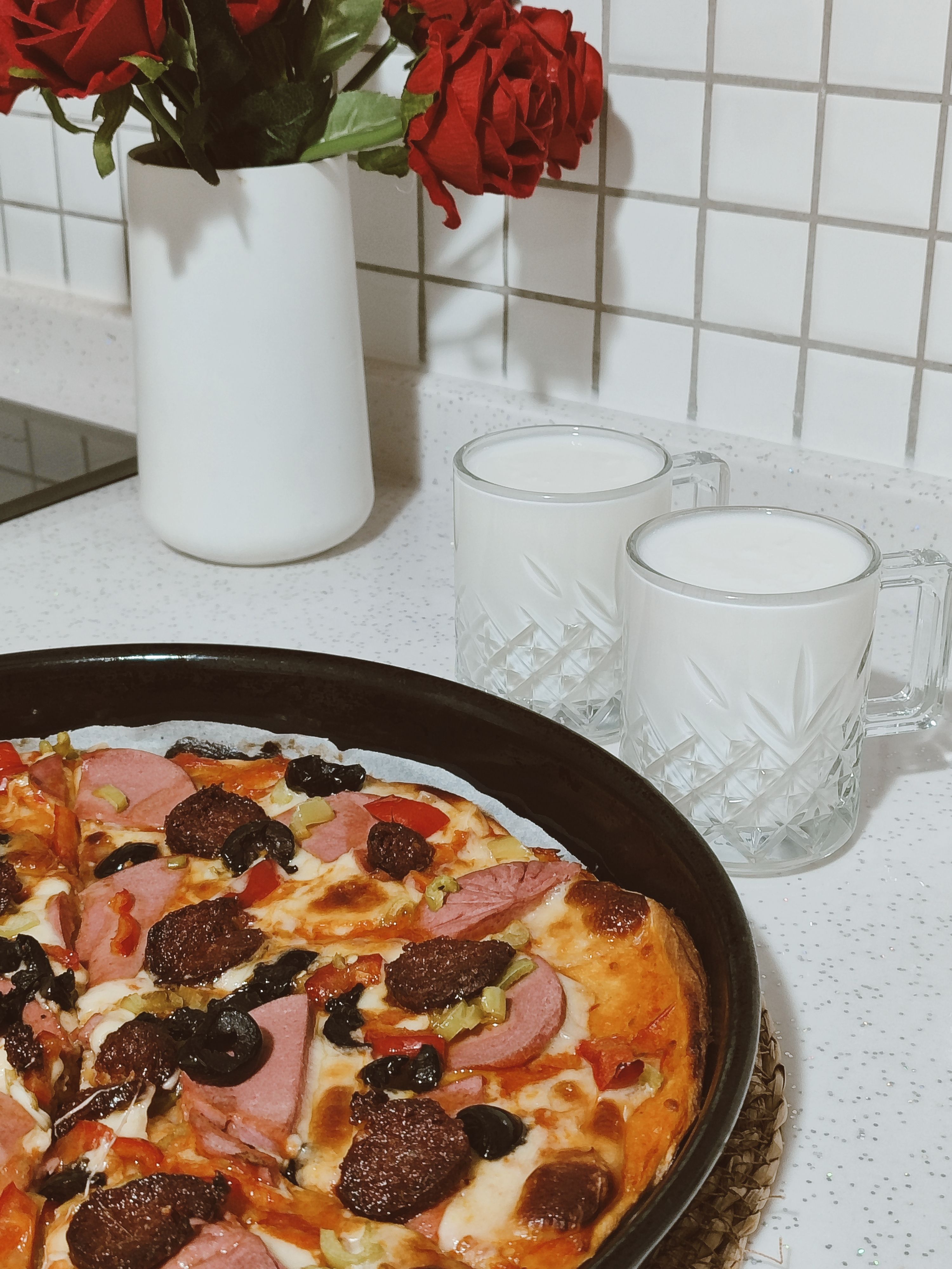 Delicious Homemade Pizza with Milk and Flowers · Free Stock Photo
