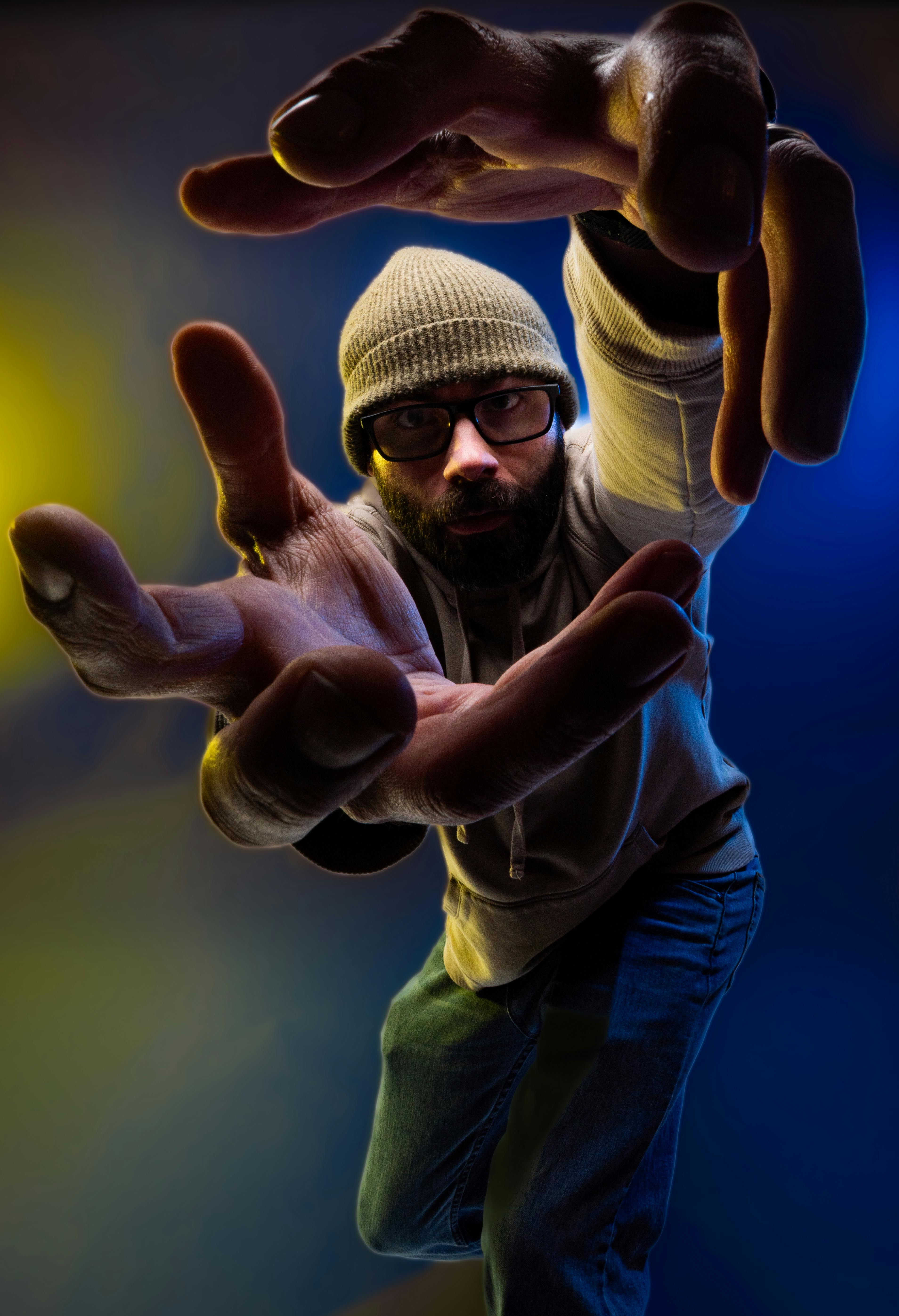 Dynamic Portrait of a Man Reaching Forward · Free Stock Photo