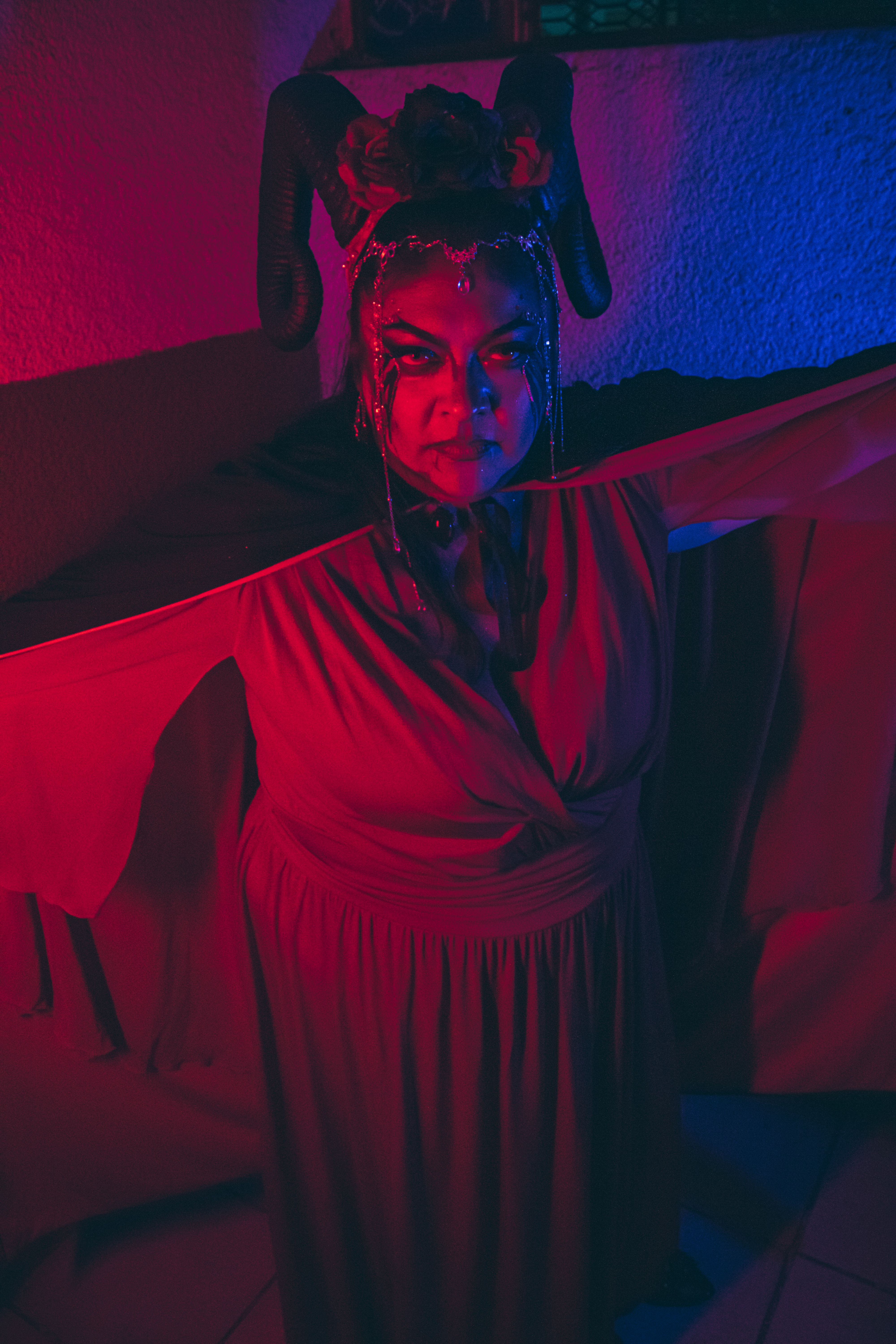 Dramatic Portrait with Horned Makeup and Red Cape · Free Stock Photo