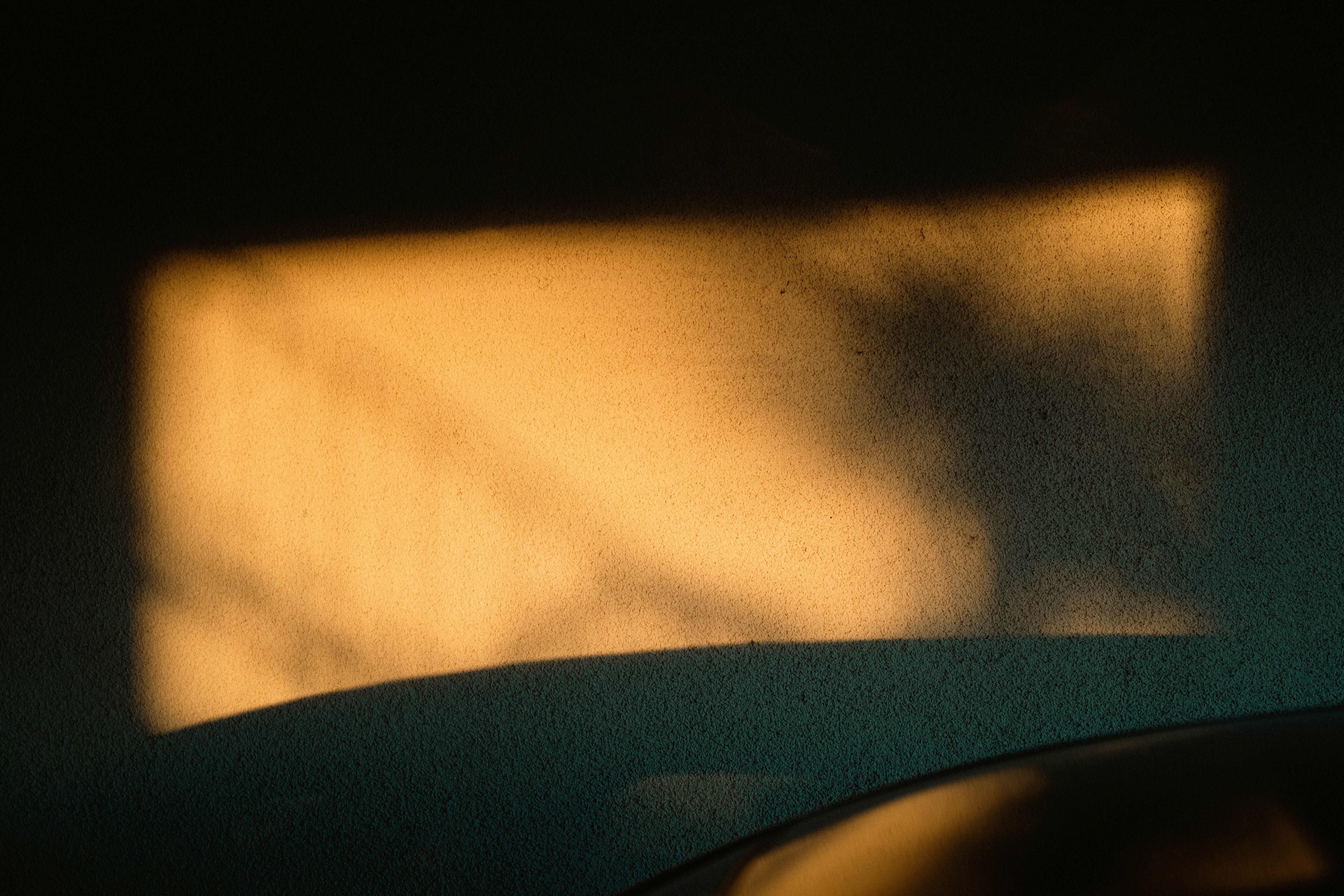 Abstract Shadow Art on Textured Wall · Free Stock Photo
