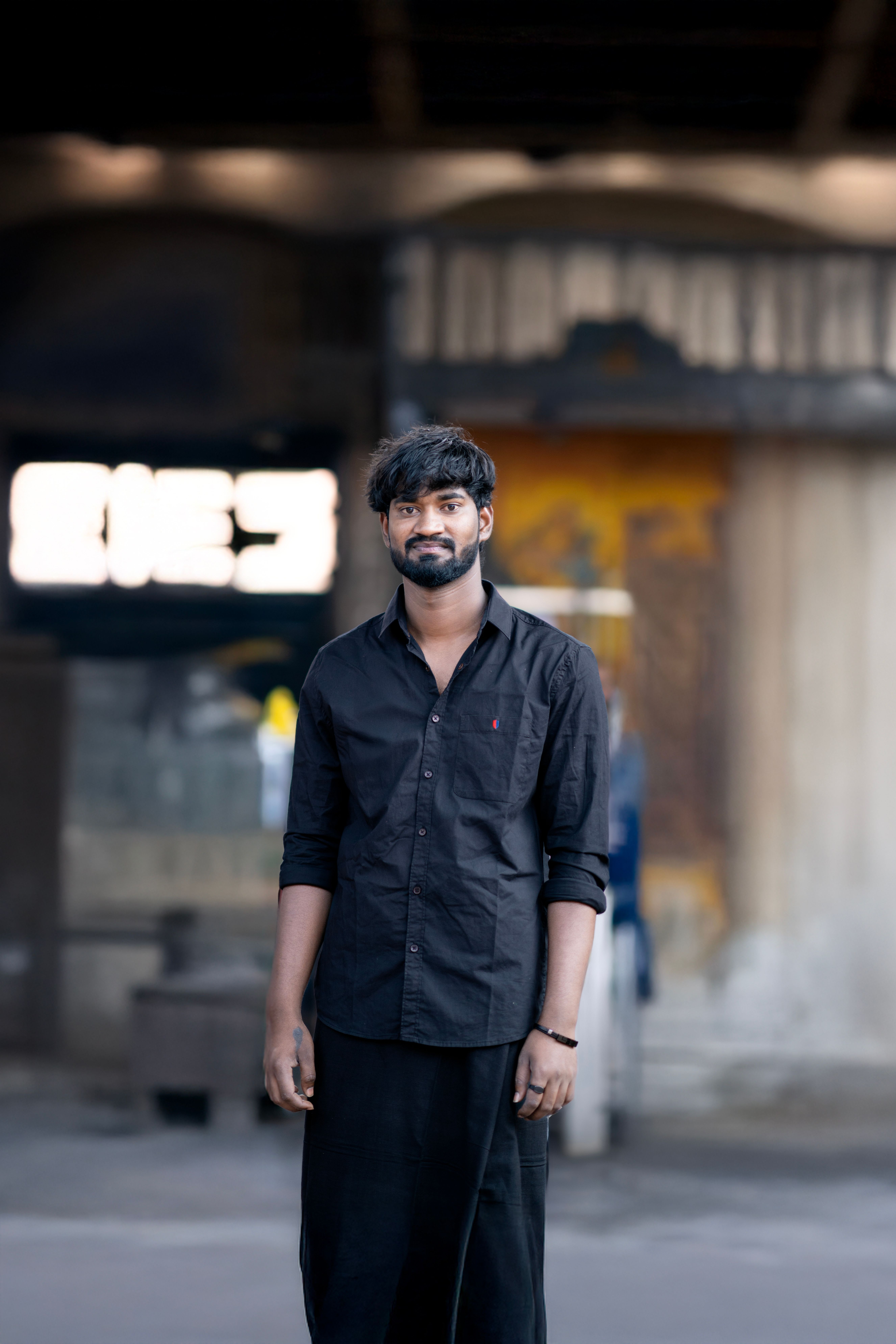 Young Man Posing in Urban Street Setting · Free Stock Photo