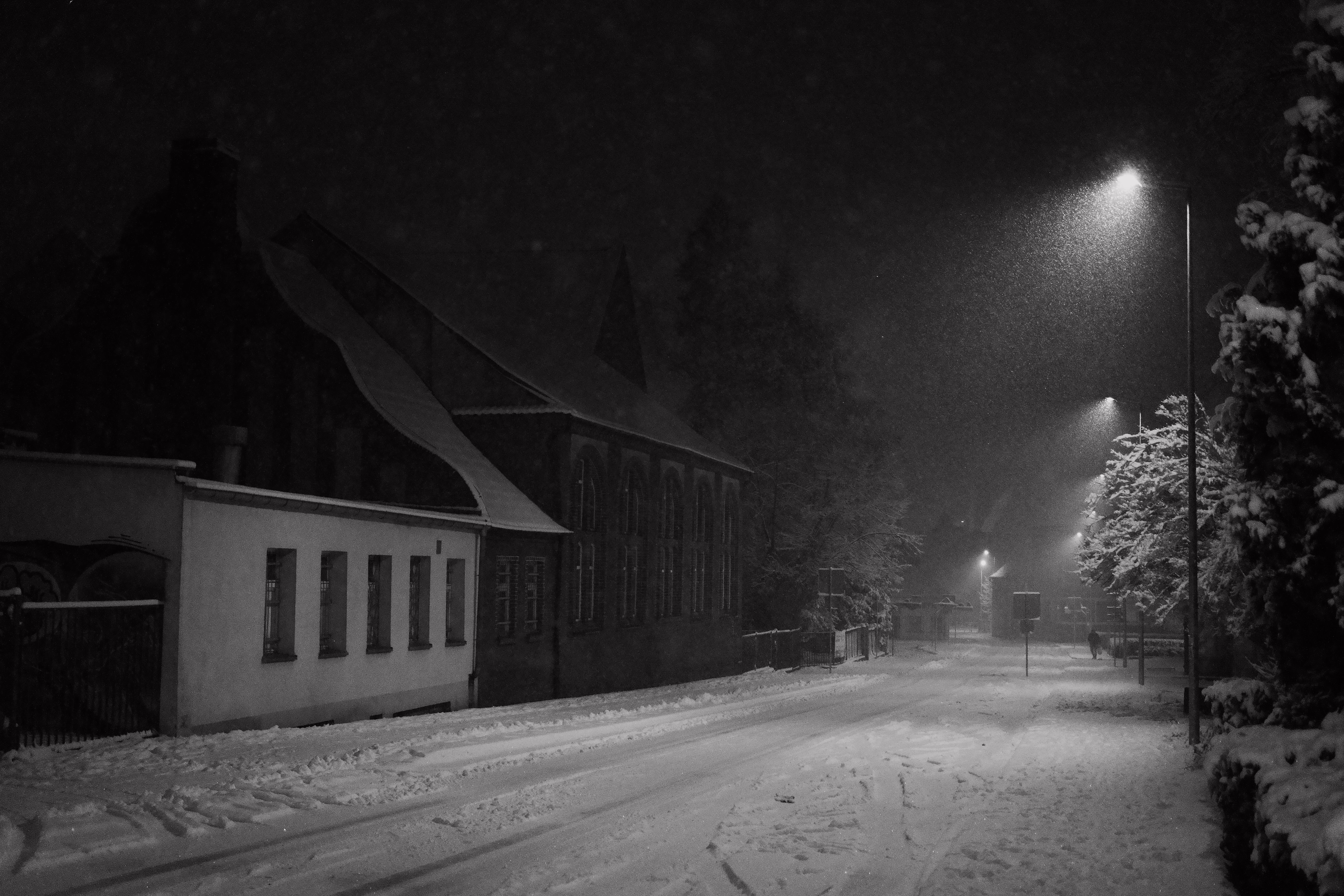Silent snowy street at night with streetlights · Free Stock Photo
