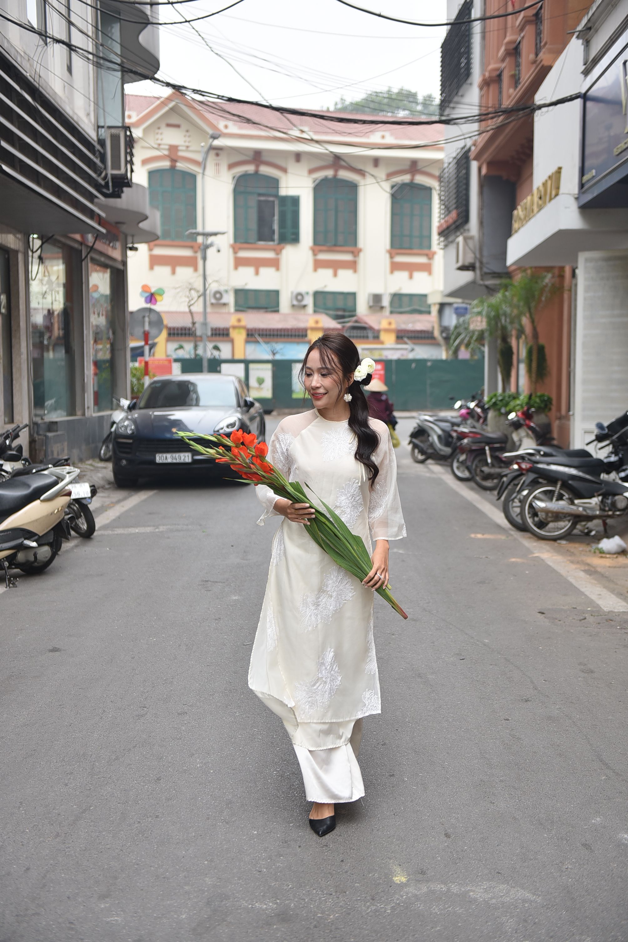 Woman in Traditional Dress Walking on Urban Street · Free Stock Photo