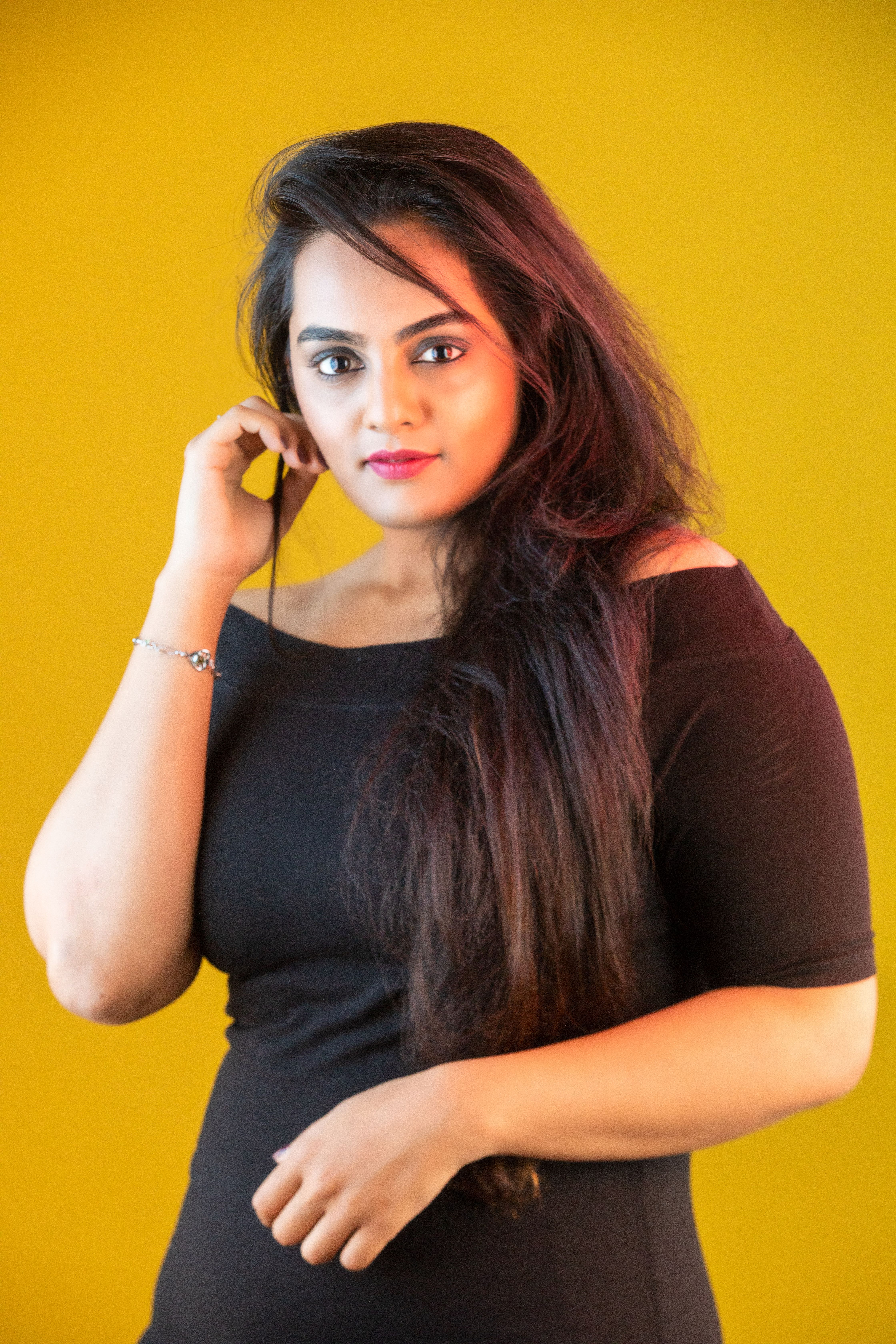 Portrait of Woman Against Yellow Background · Free Stock Photo