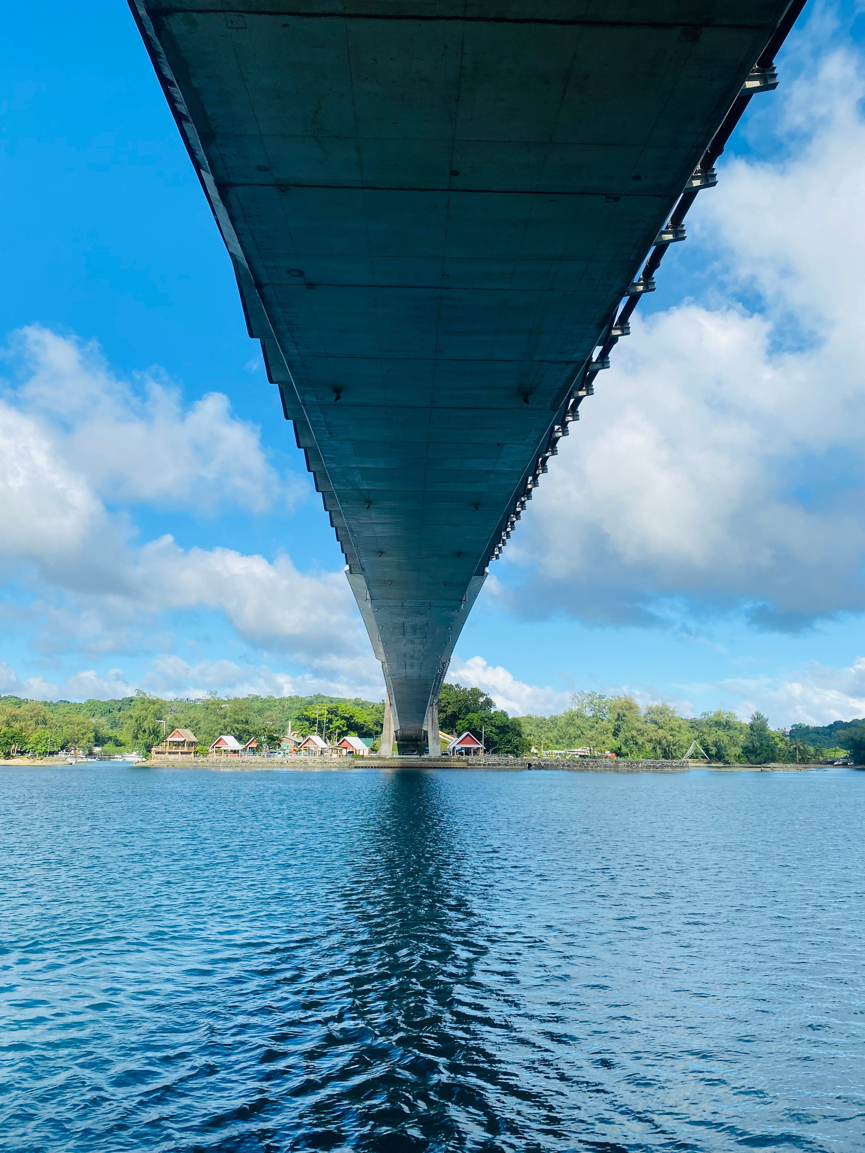 Underneath a Majestic Bridge Over Clear Water · Free Stock Photo