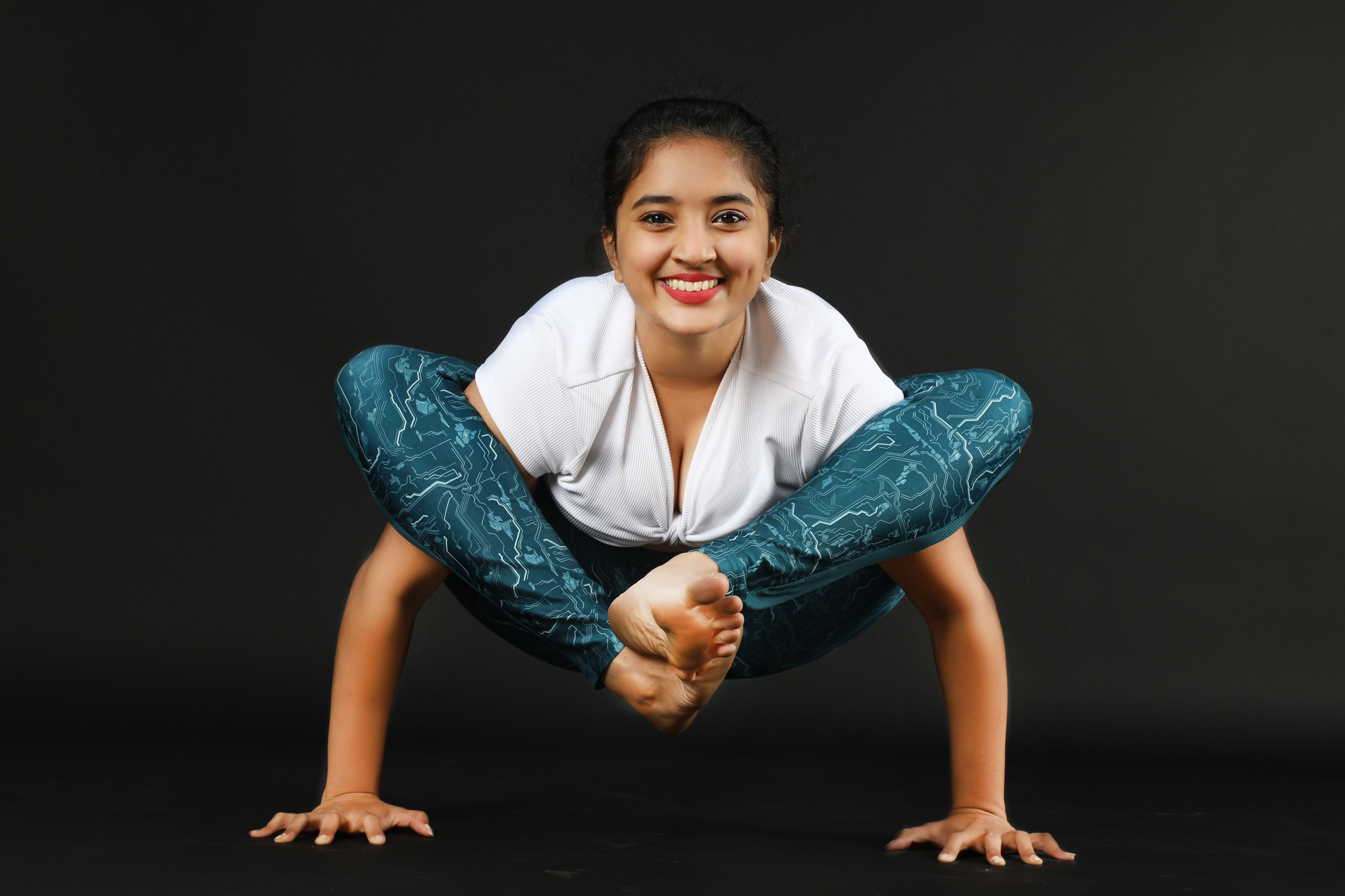 Young Woman Practicing Advanced Yoga Pose · Free Stock Photo