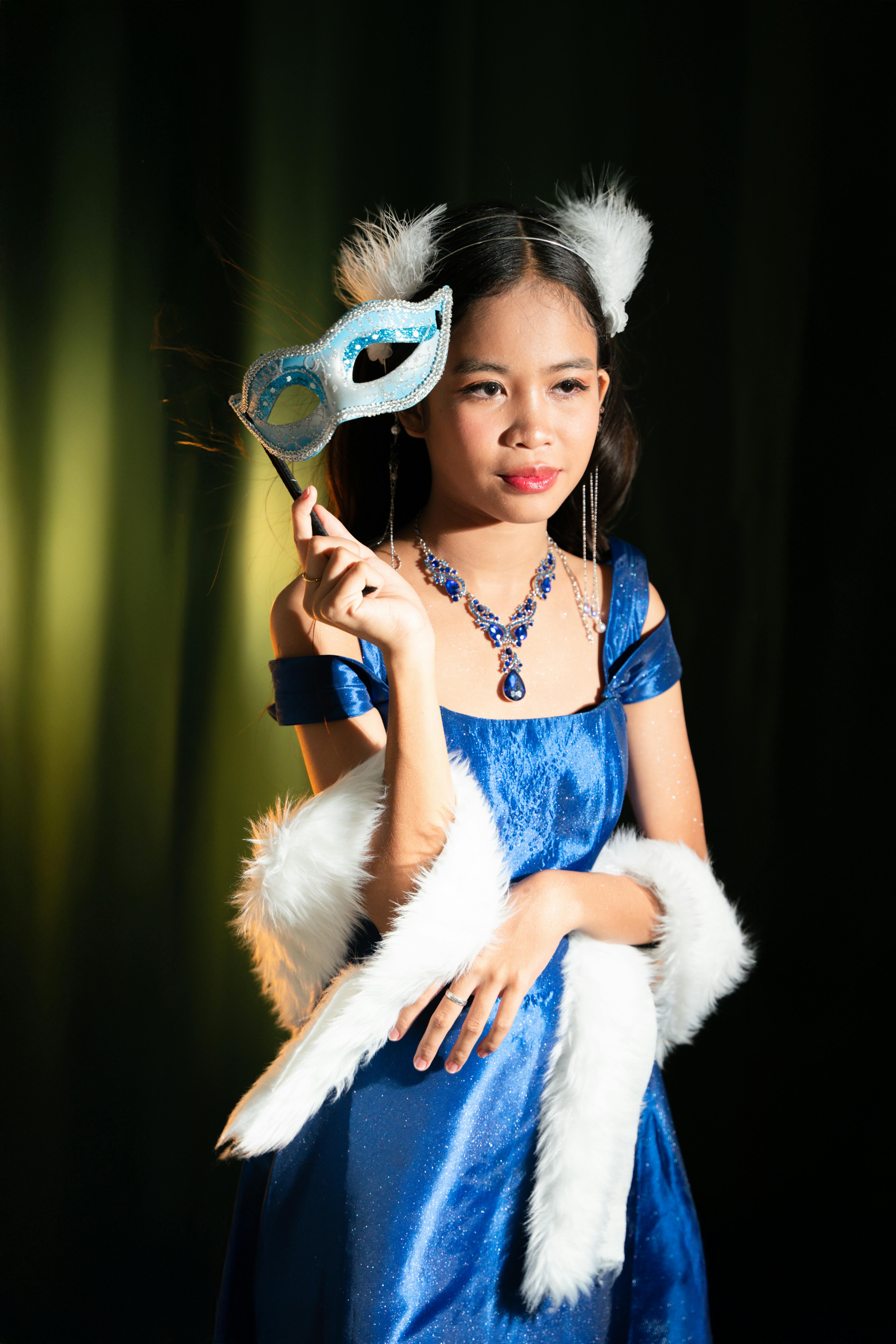 Elegant Youth in Blue Gown with Mask · Free Stock Photo