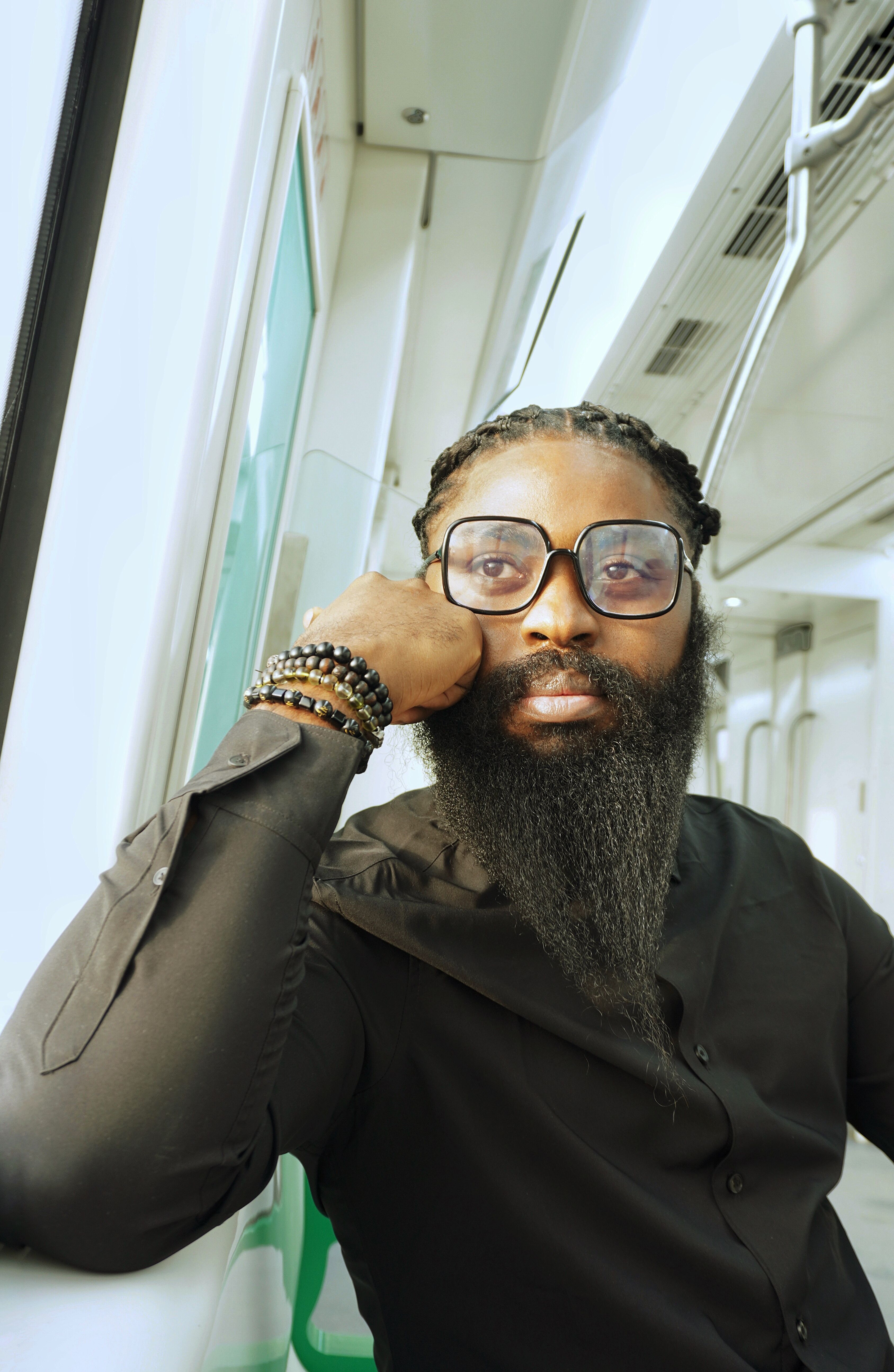 Stylish Bearded Man in Urban Train Setting · Free Stock Photo