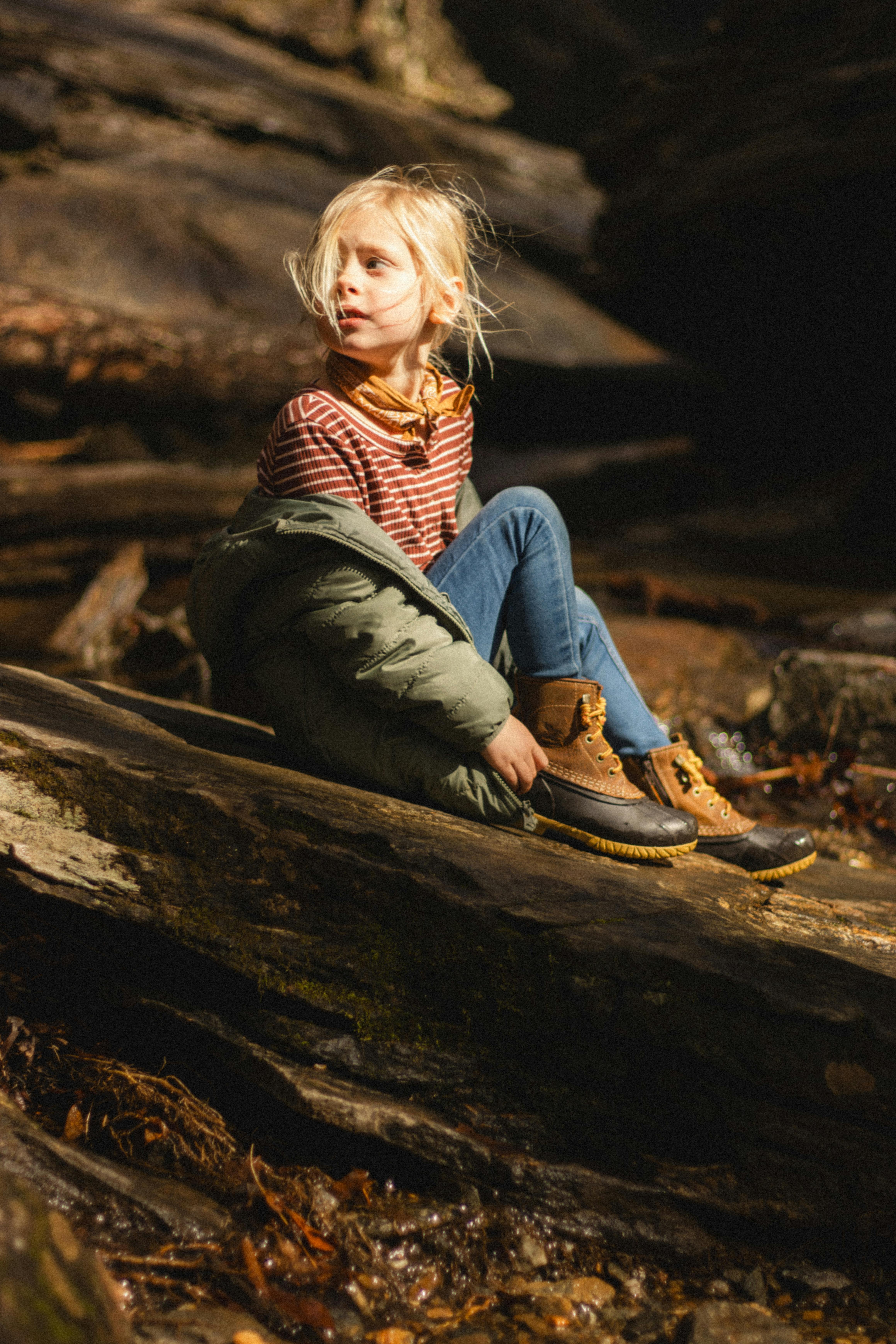 Child Exploring Nature in Rugged Boots · Free Stock Photo
