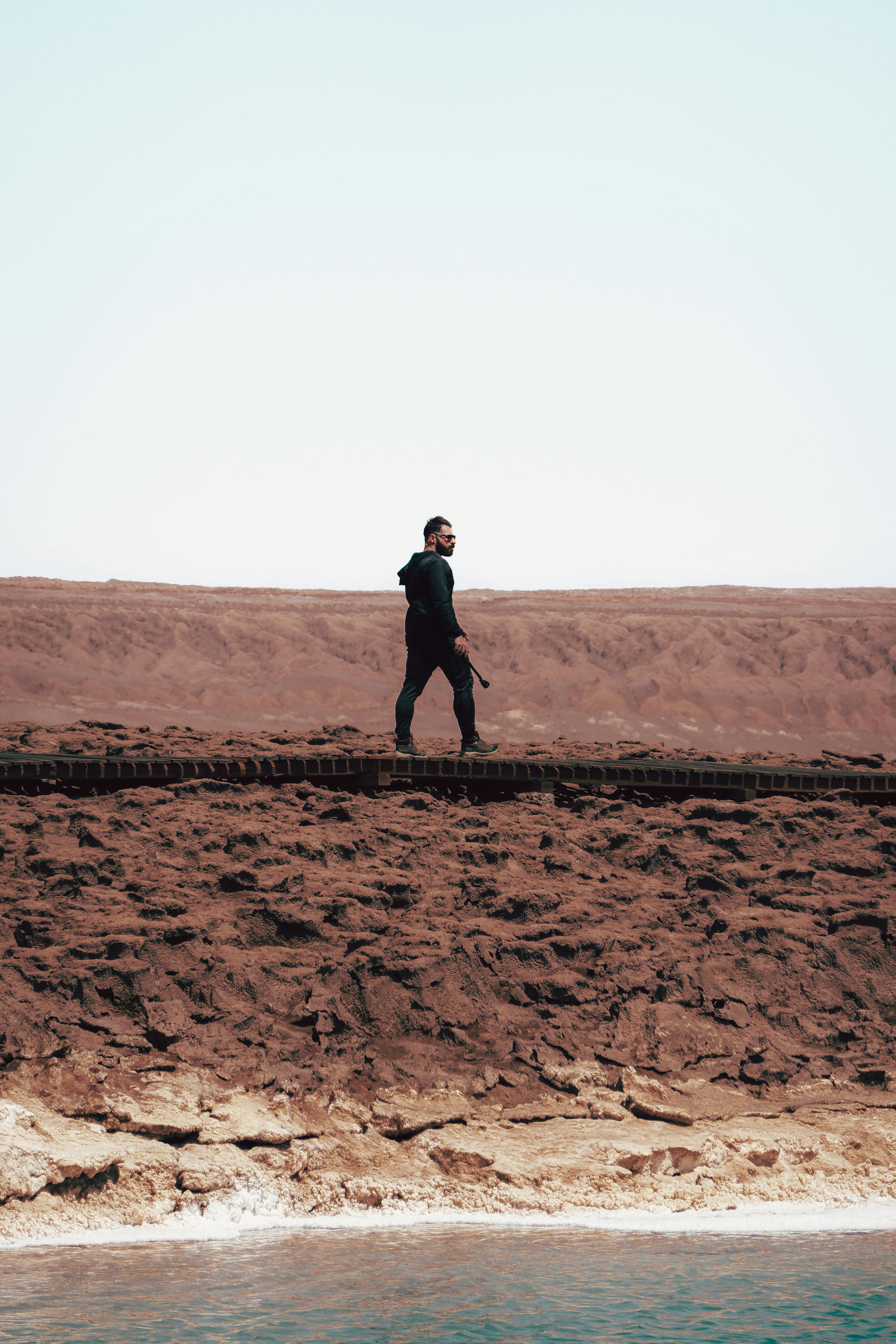 Man Walking in the Atacama Desert Landscape · Free Stock Photo