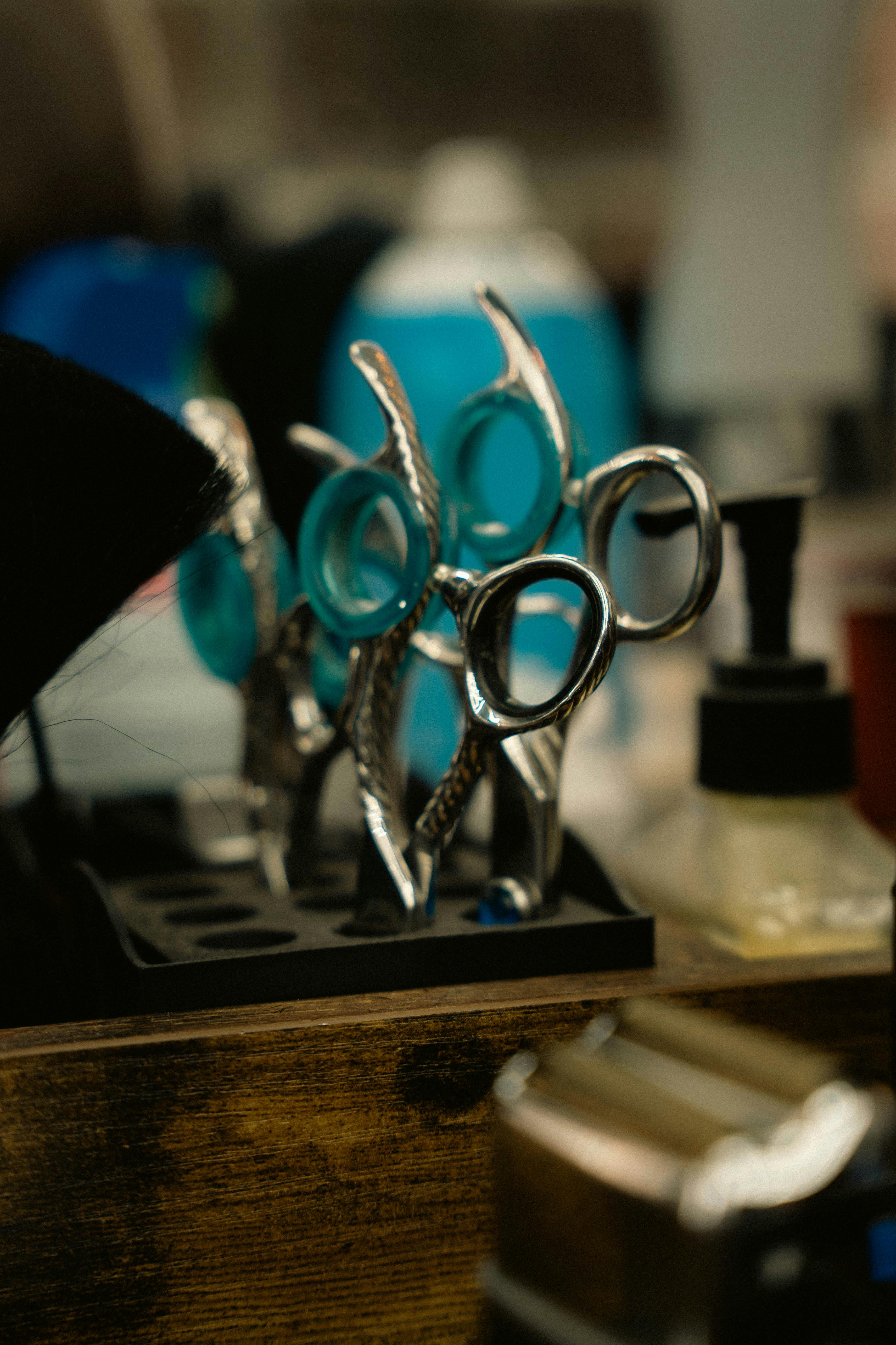 Professional Hairdressing Scissors in Salon Setup · Free Stock Photo
