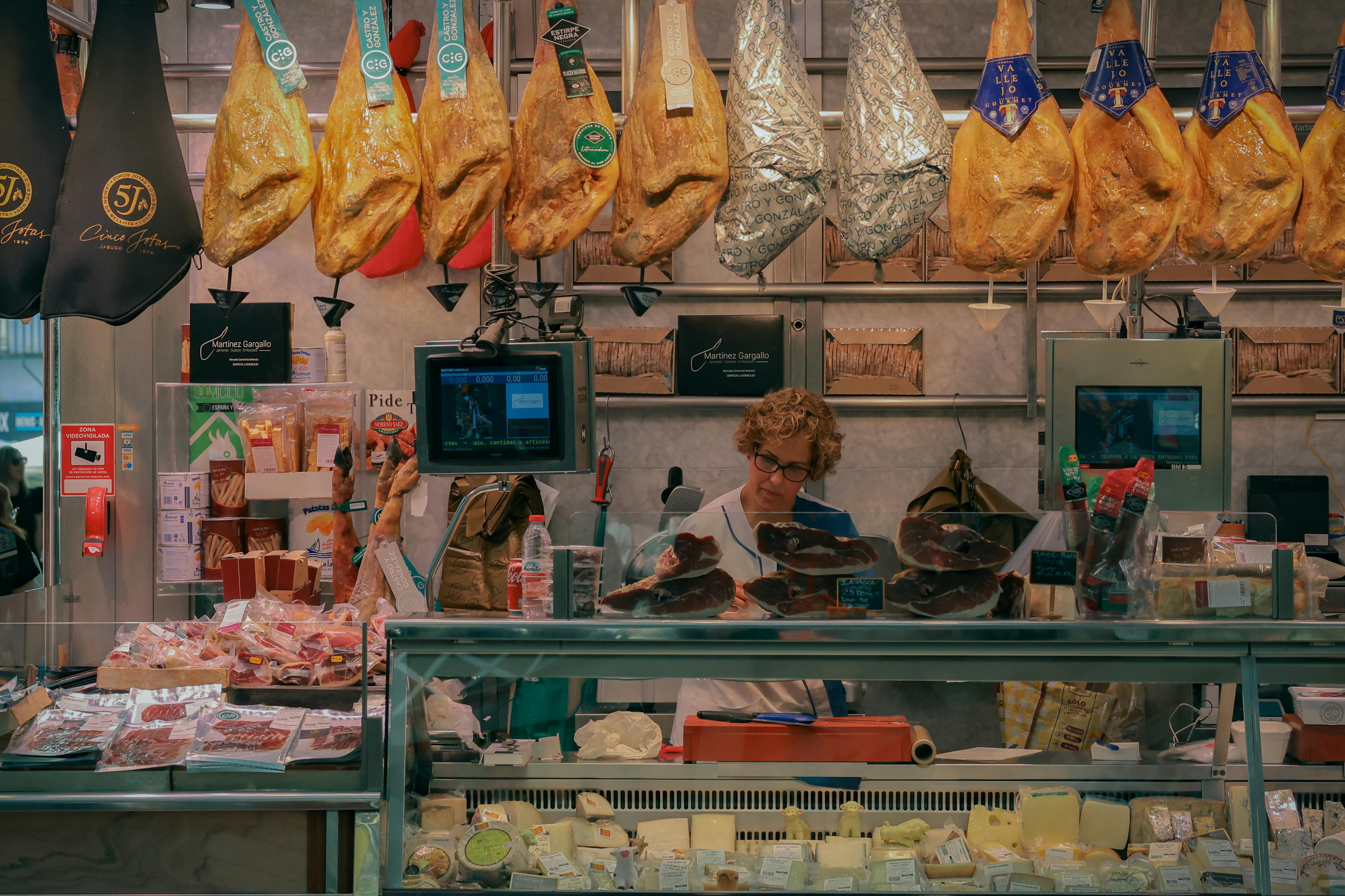 Market Scene in Valencia with Jamón and Cheese · Free Stock Photo