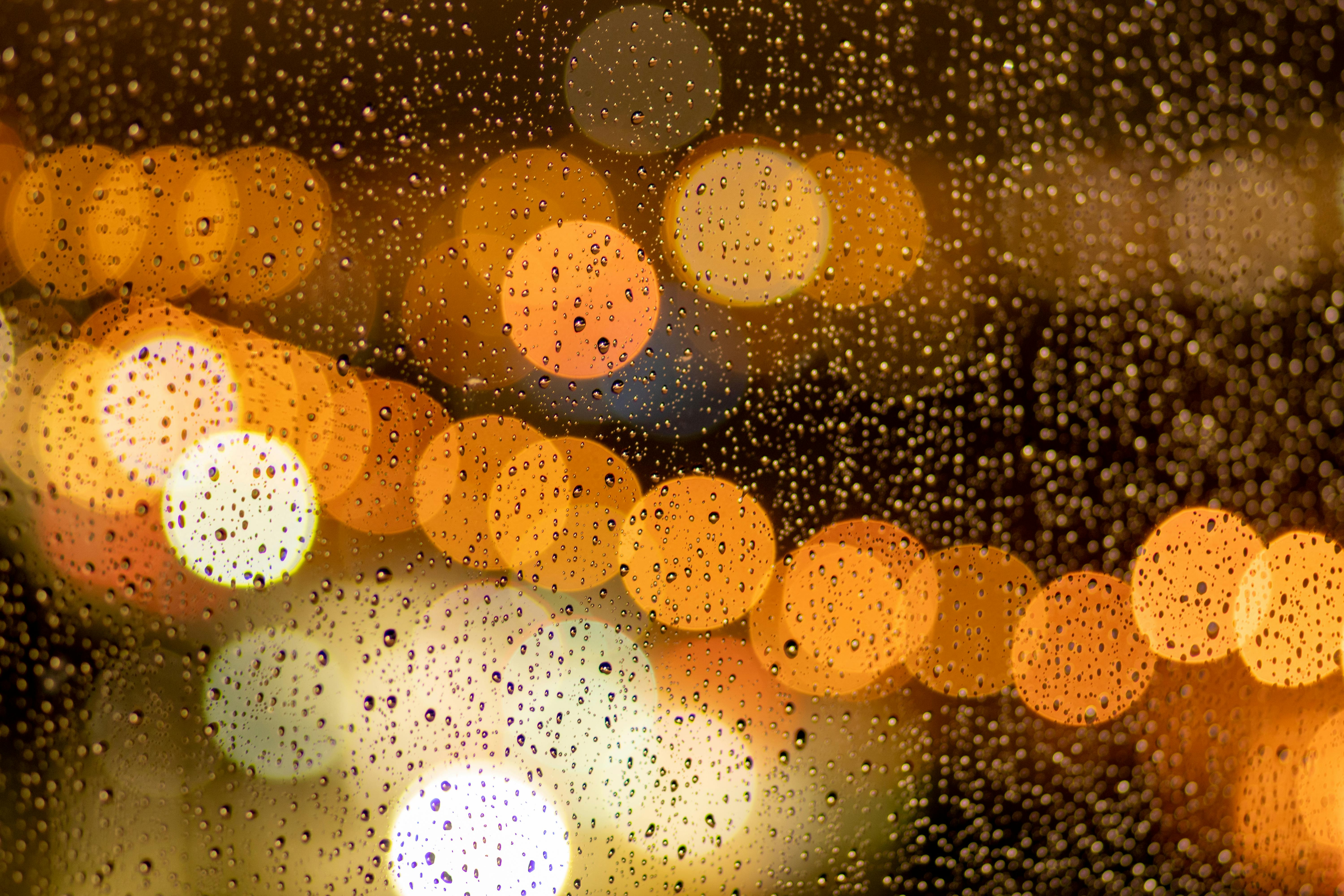 Raindrop-Covered Window with Bokeh Lights · Free Stock Photo