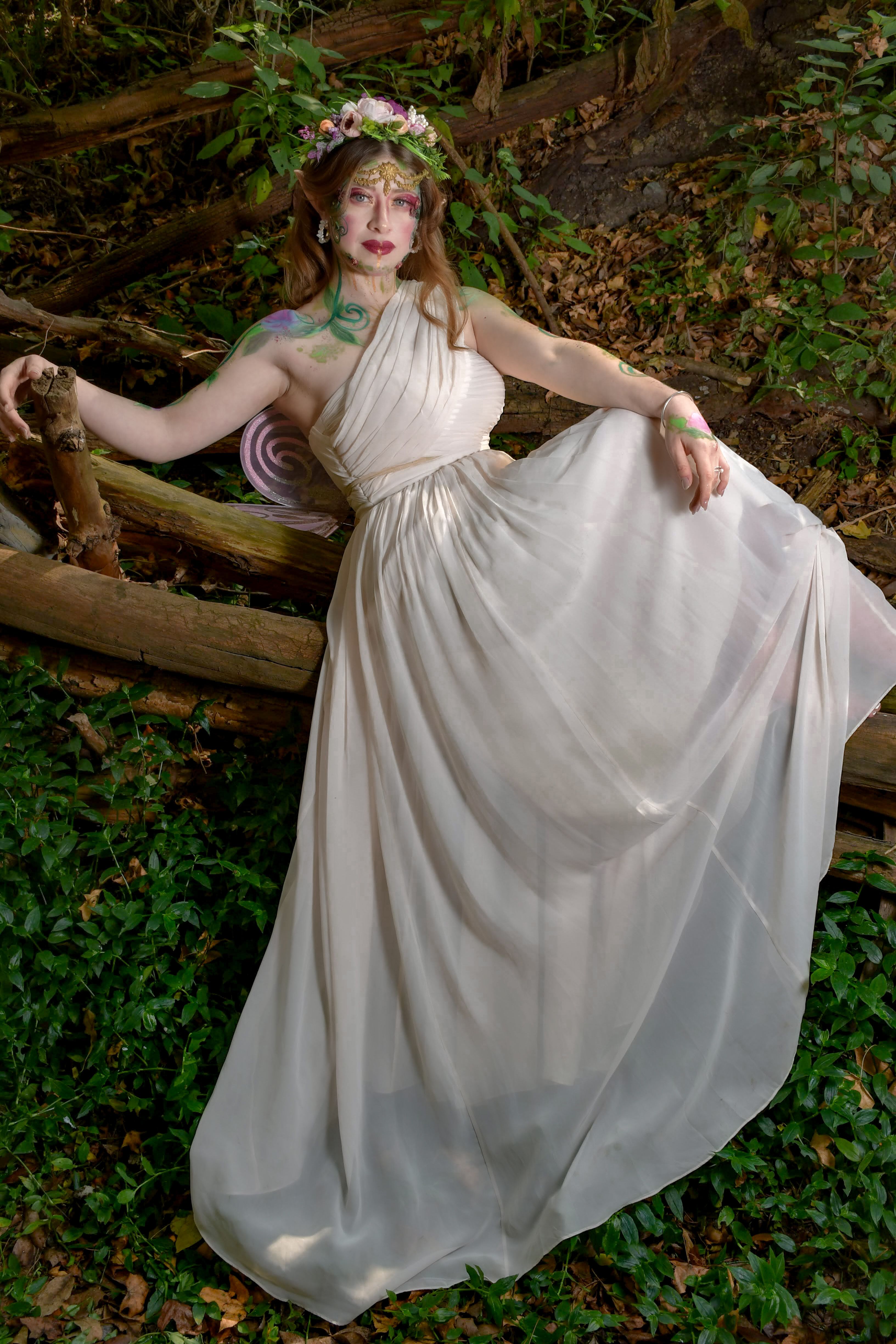 Elegant Woman in Flowing Dress in Forest Setting · Free Stock Photo