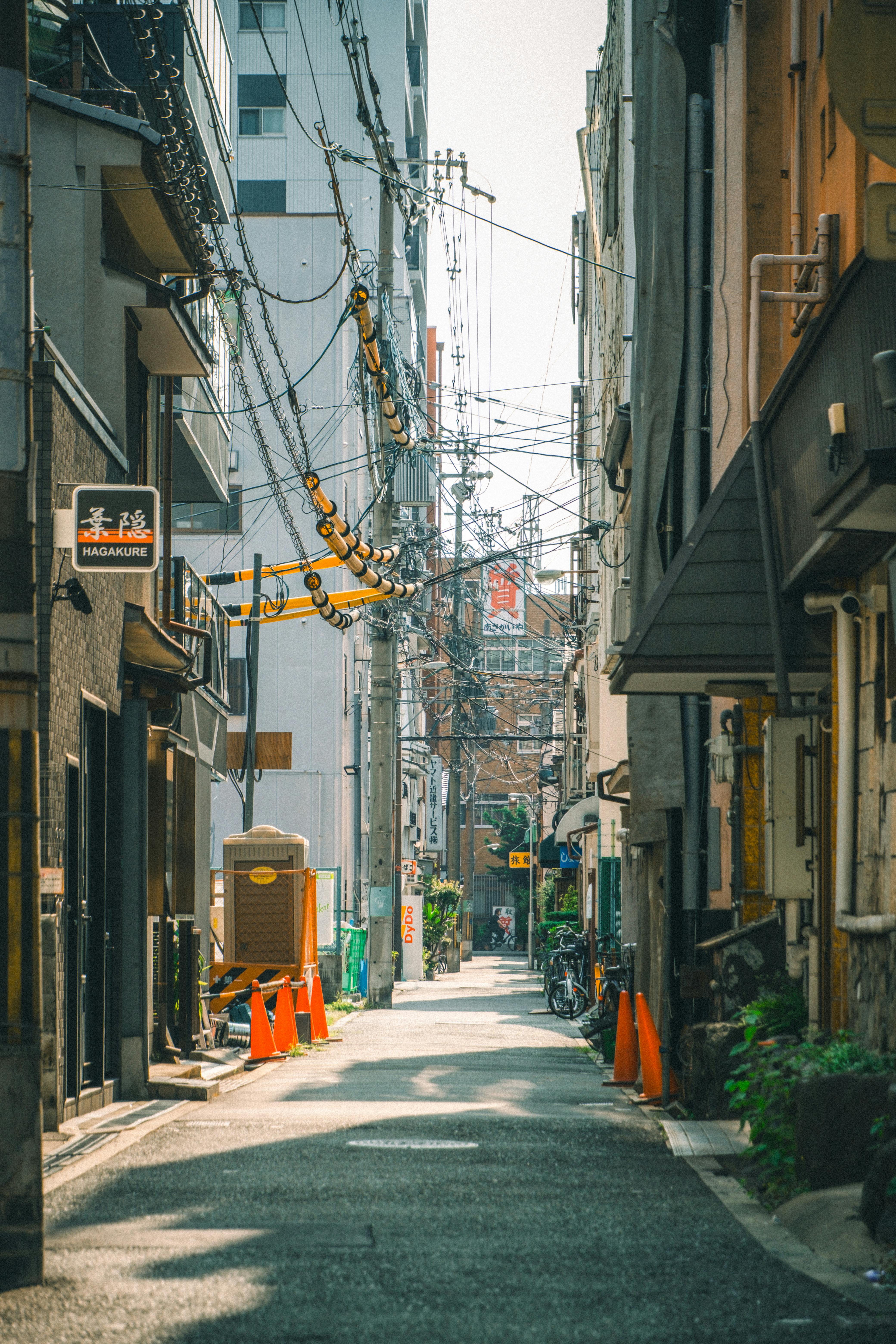 Urban Alleyway in Japanese City with Overhead Wires · Free Stock Photo