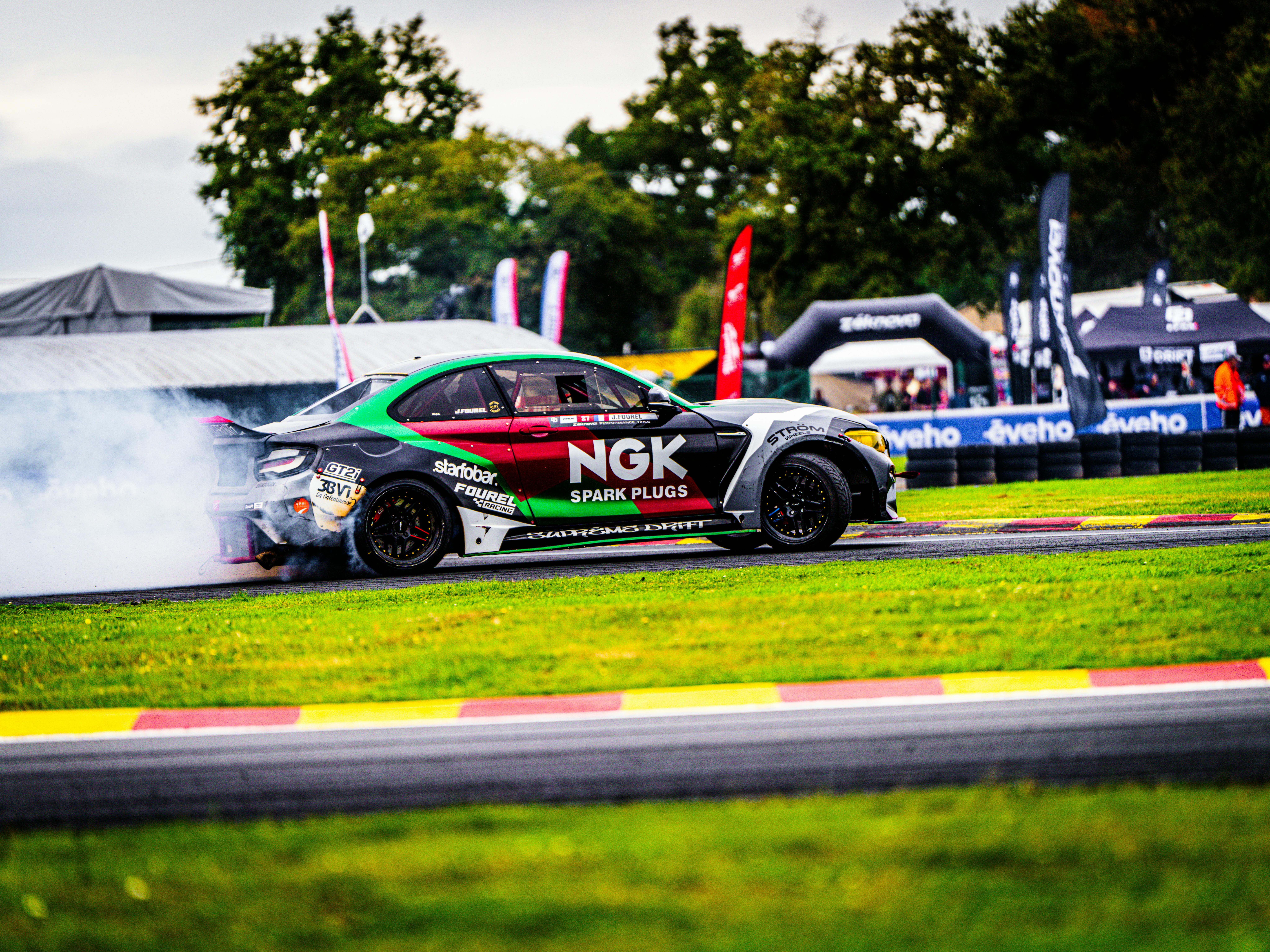 Dynamic Car Drift at Racing Event in France · Free Stock Photo