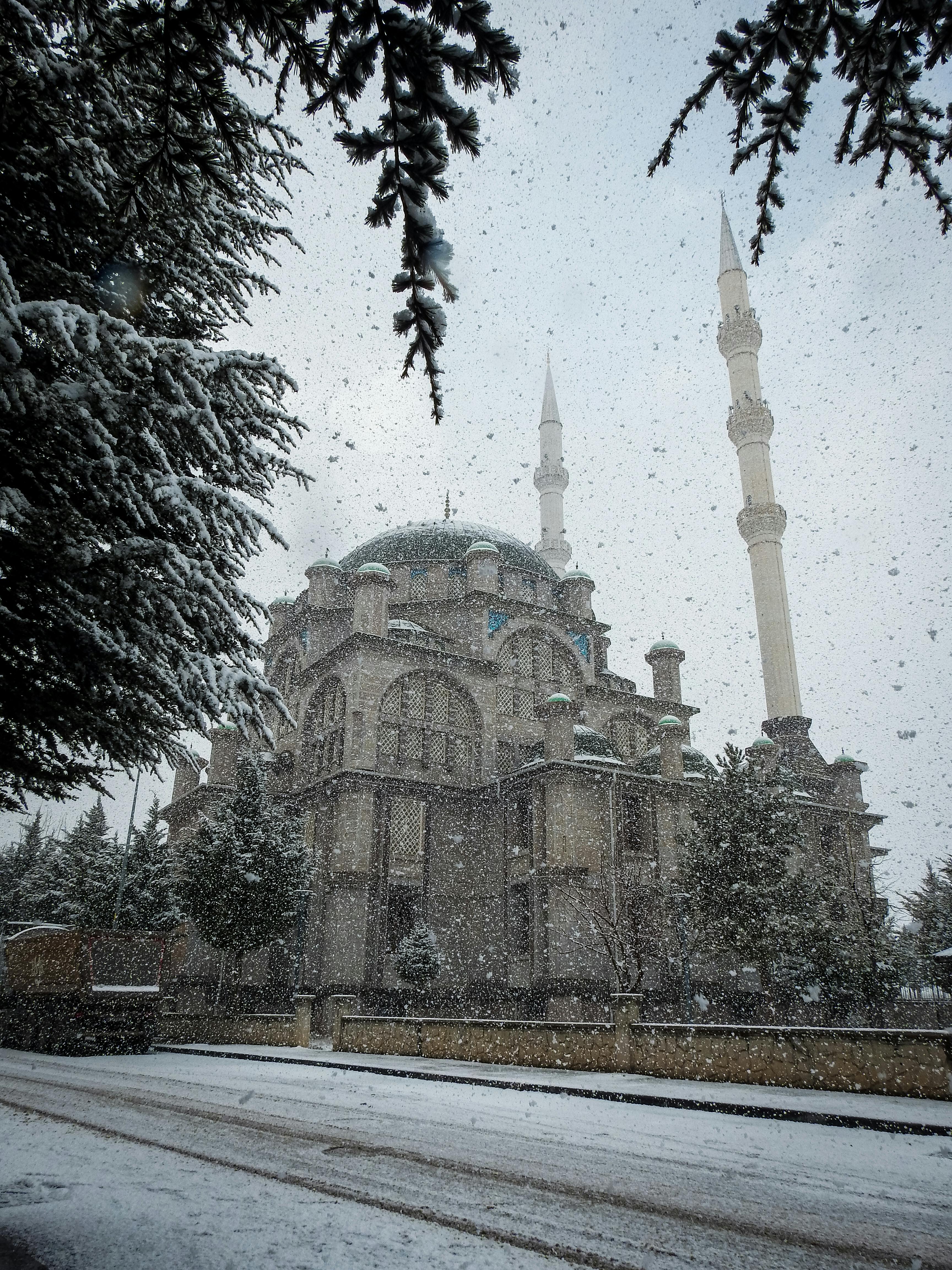Snow-Covered Mosque Amidst Winter Scene · Free Stock Photo