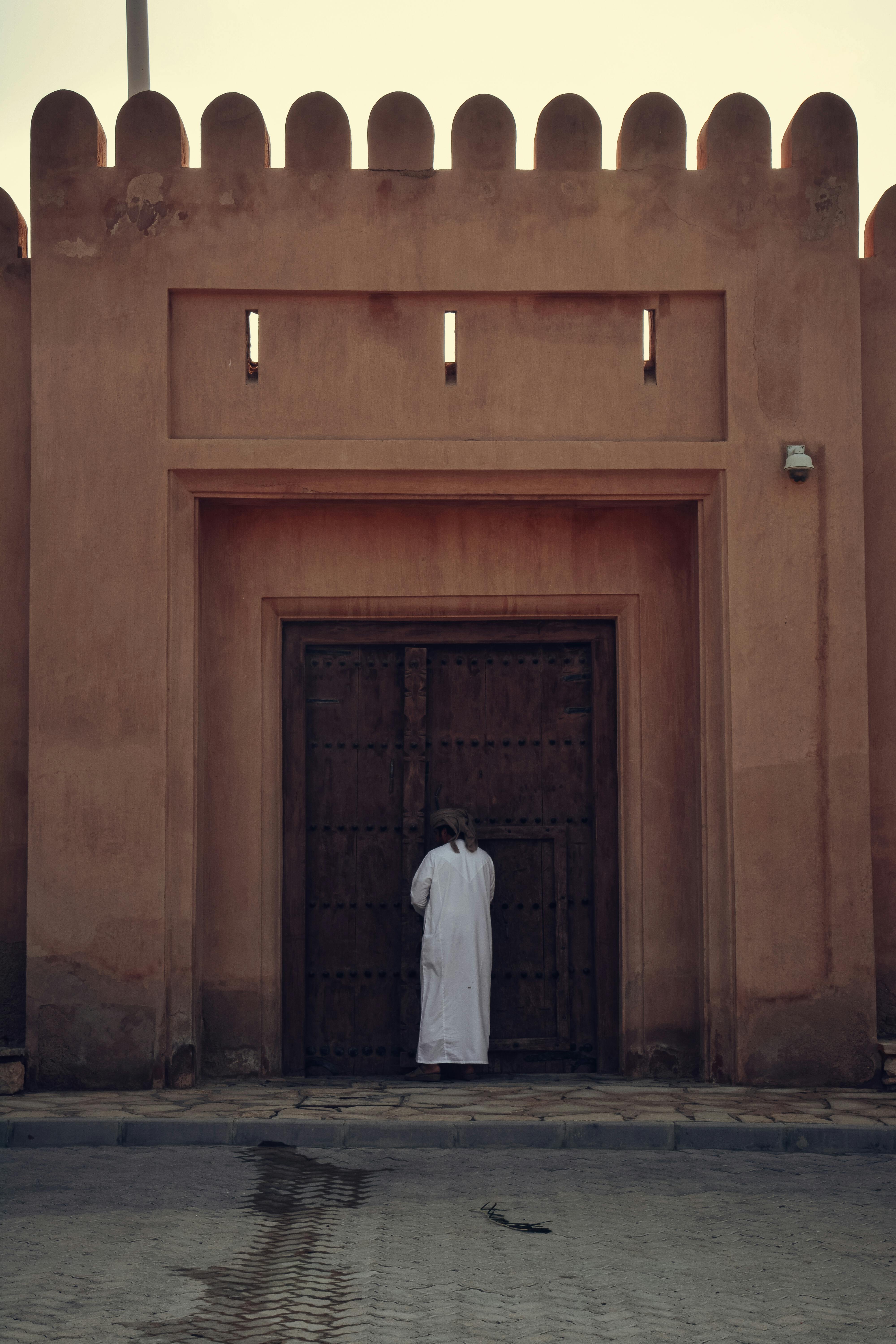 Traditional Omani Architecture with Wooden Door · Free Stock Photo