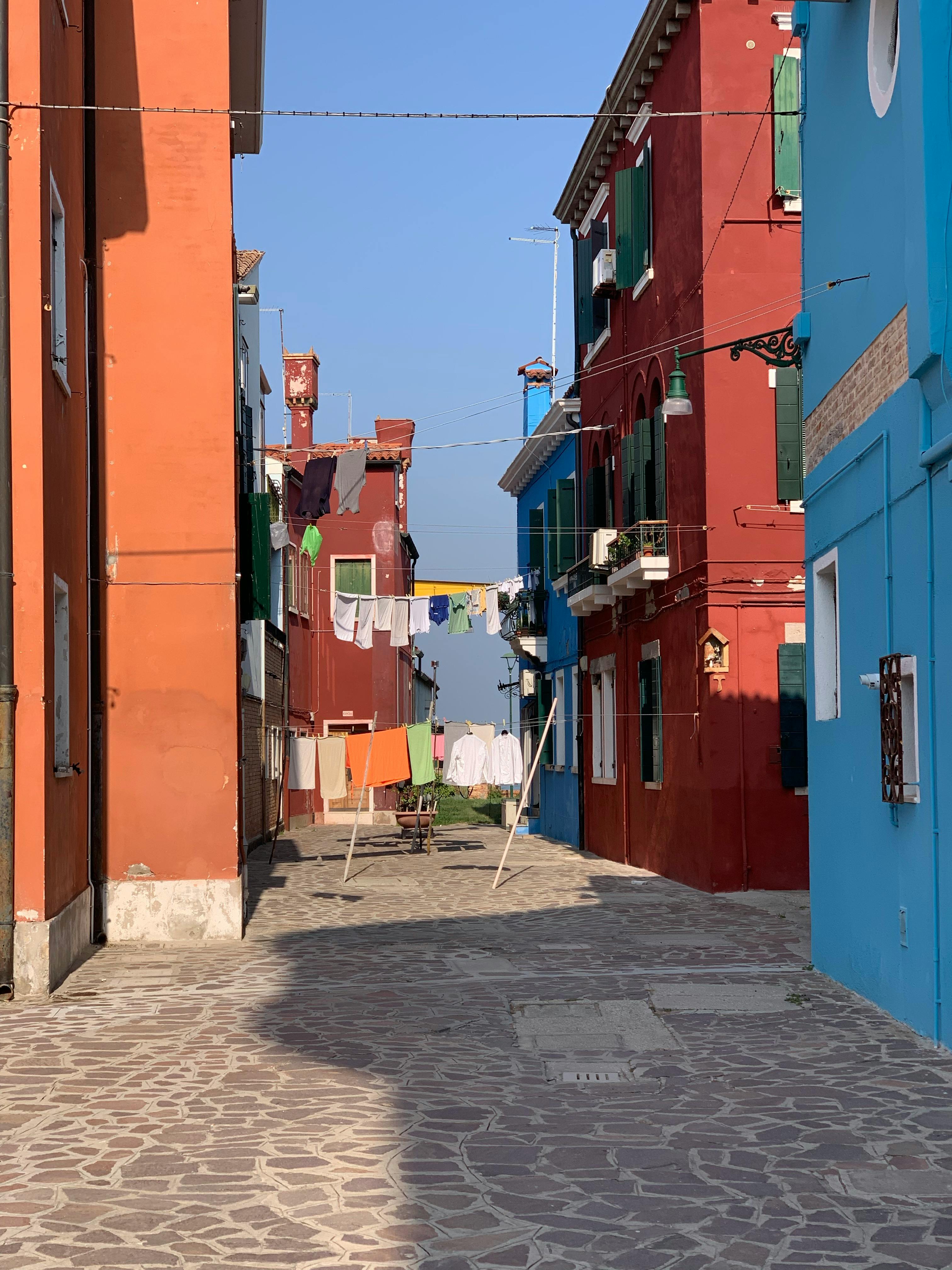 Colorful street view with laundry in Burano · Free Stock Photo