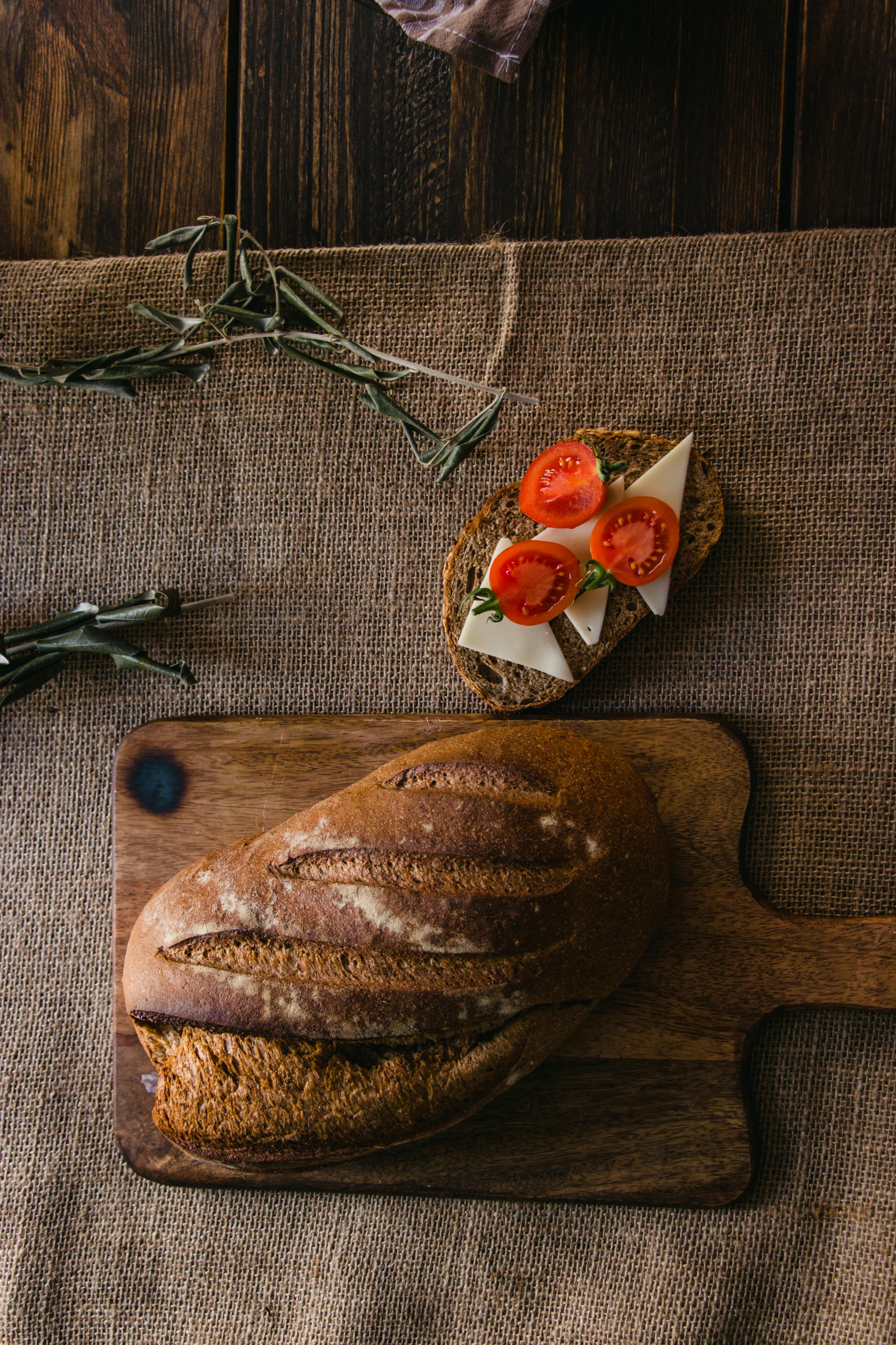 Rustic Artisan Bread with Cheese and Tomatoes · Free Stock Photo