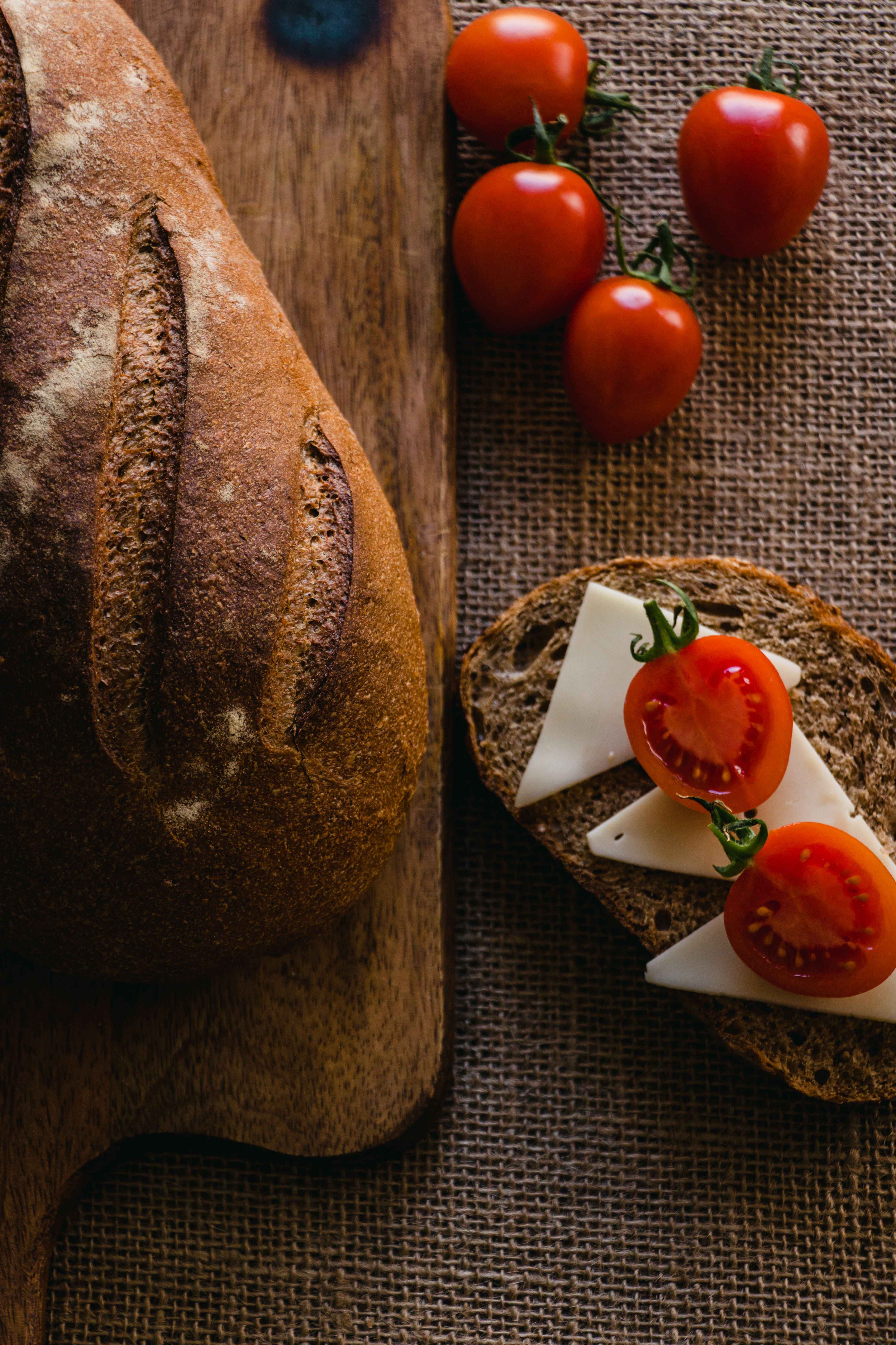 Rustic Bread with Cheese and Cherry Tomatoes · Free Stock Photo
