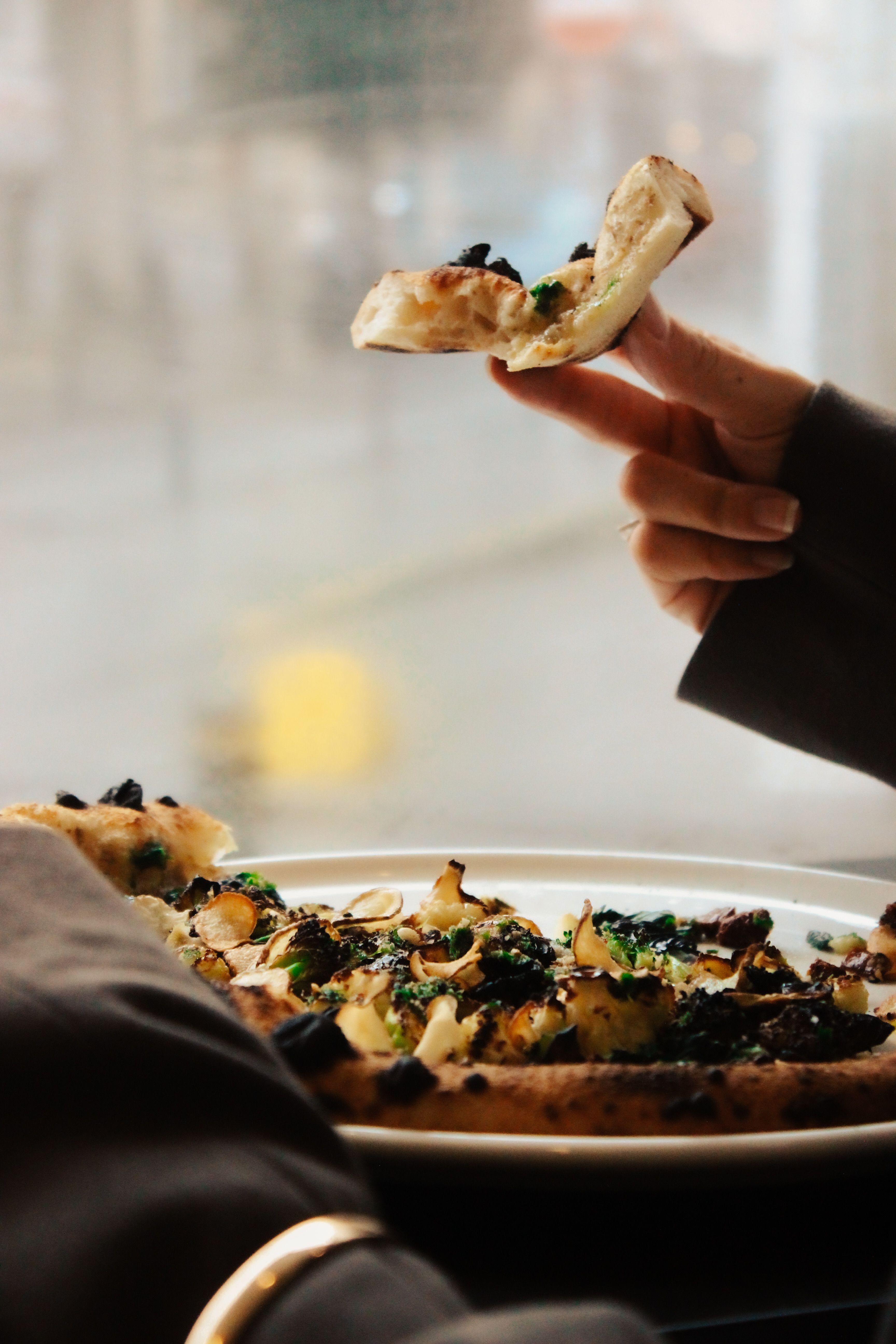 Gourmet Pizza Slice with Fresh Toppings Indoors · Free Stock Photo