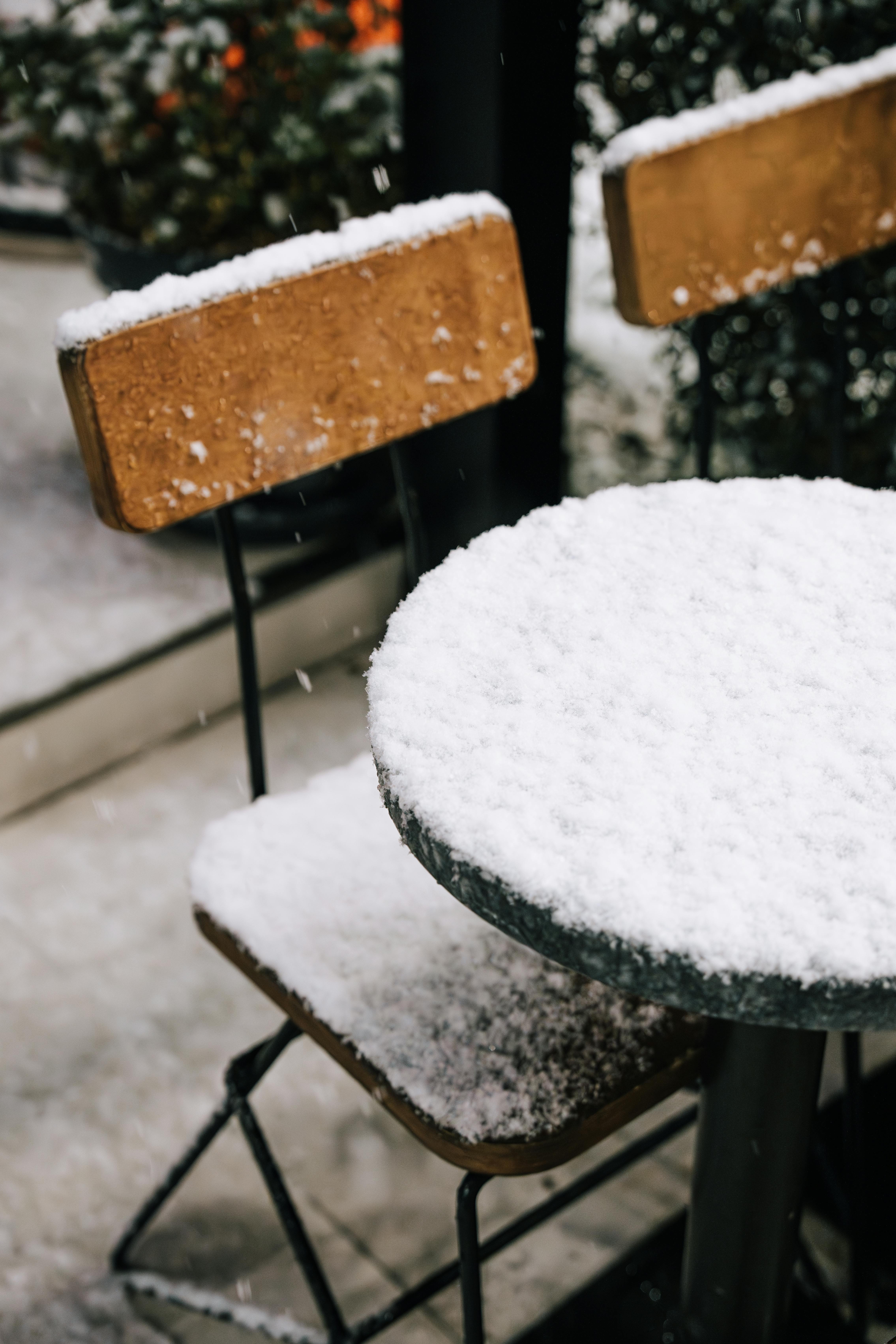 Snow-Covered Outdoor Cafe Furniture in Winter · Free Stock Photo