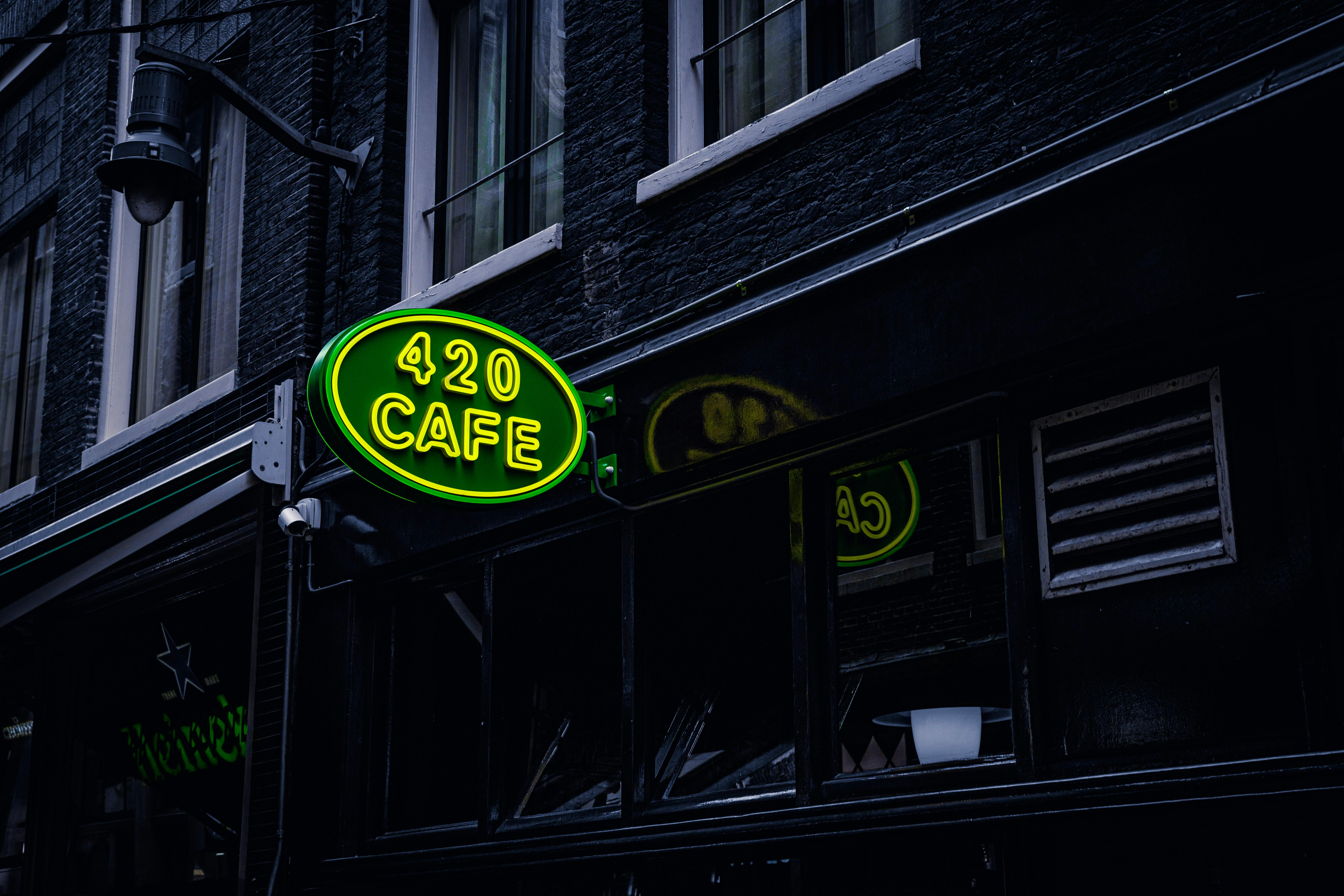 Green and Yellow 420 Cafe Neon Light Sign · Free Stock Photo